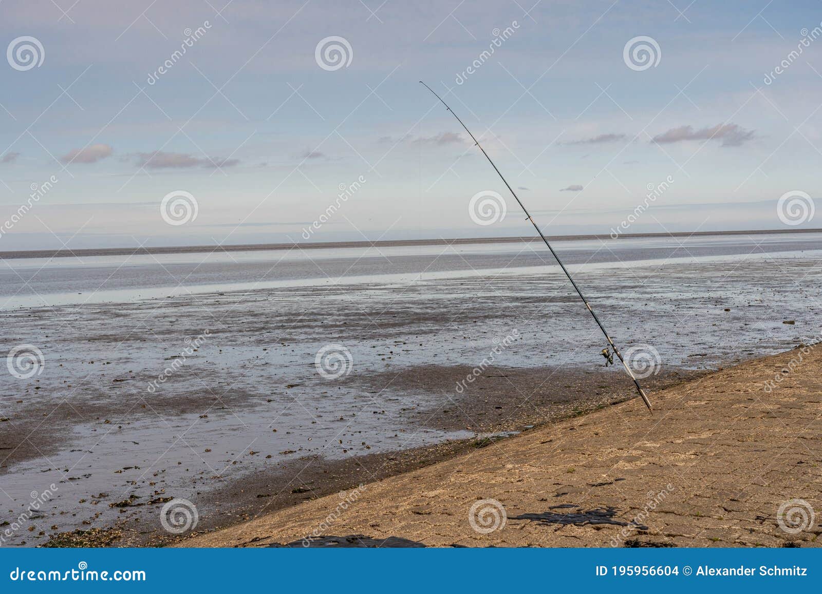 Fishing Rods Placed at the Wadden Sea at North Sea Stock Photo - Image ...