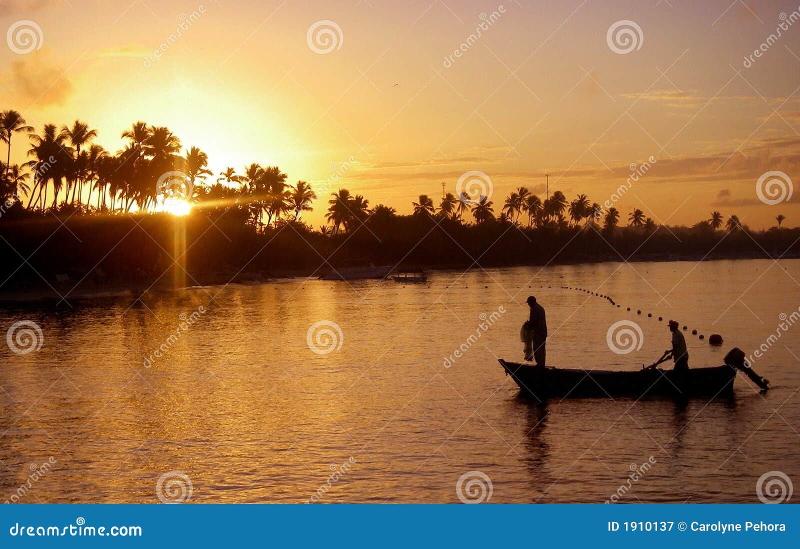 Fishing at Sunrise stock image. Image of peaceful, sunset - 1910137