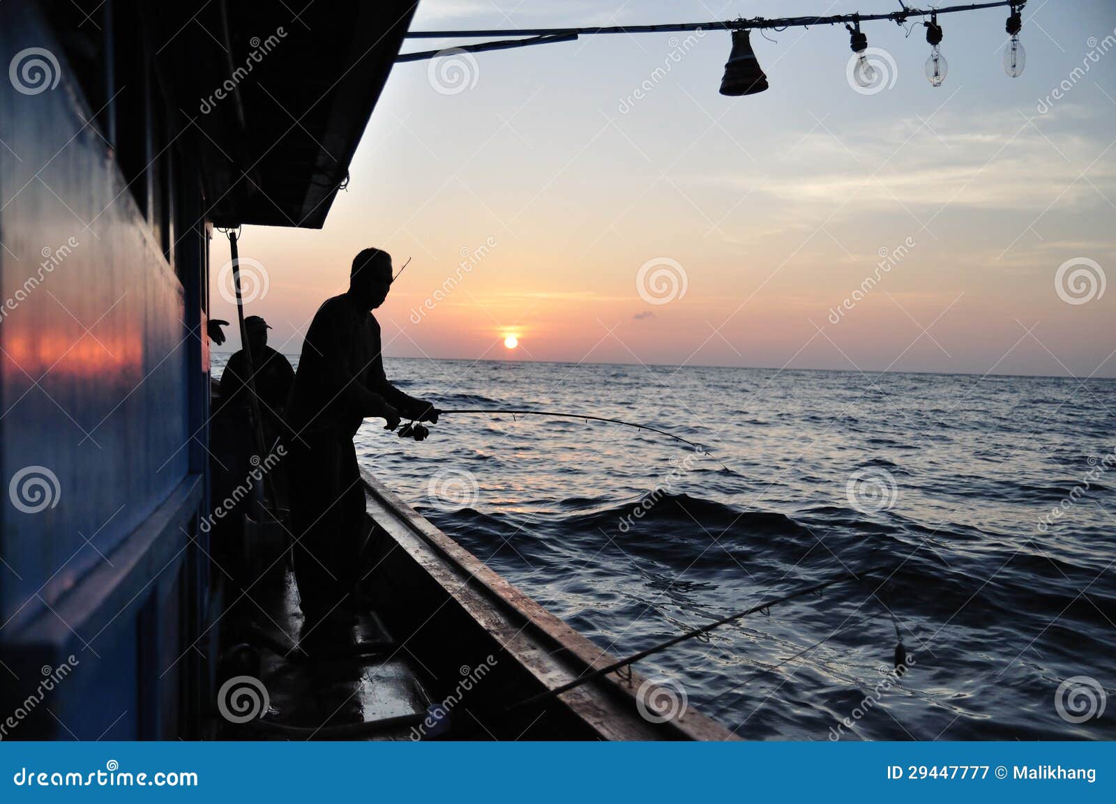 Fishing at Sunrise stock image. Image of ocean, catch - 29447777