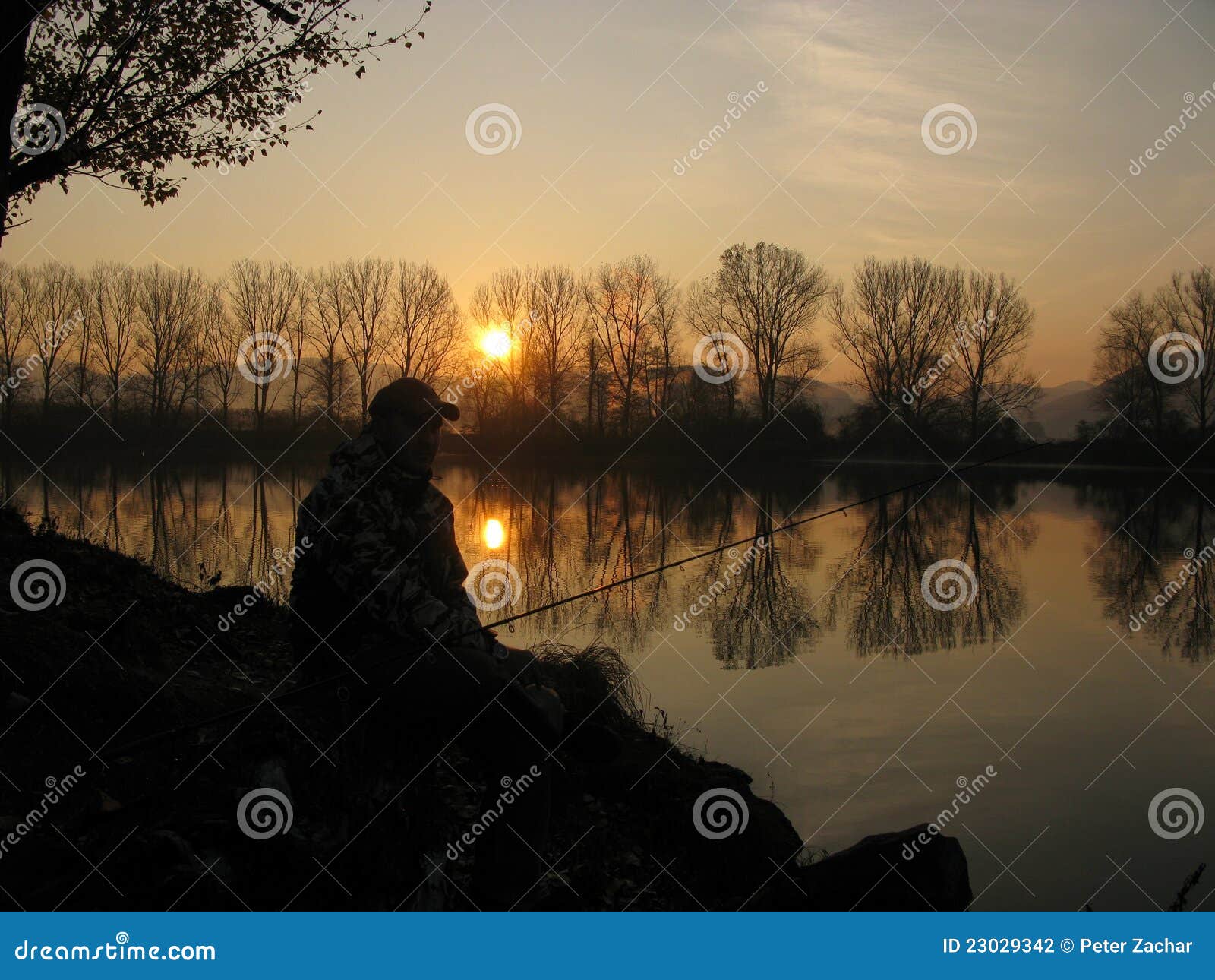 Fishing by sunset stock photo. Image of catch, fish, outdoors - 23029342