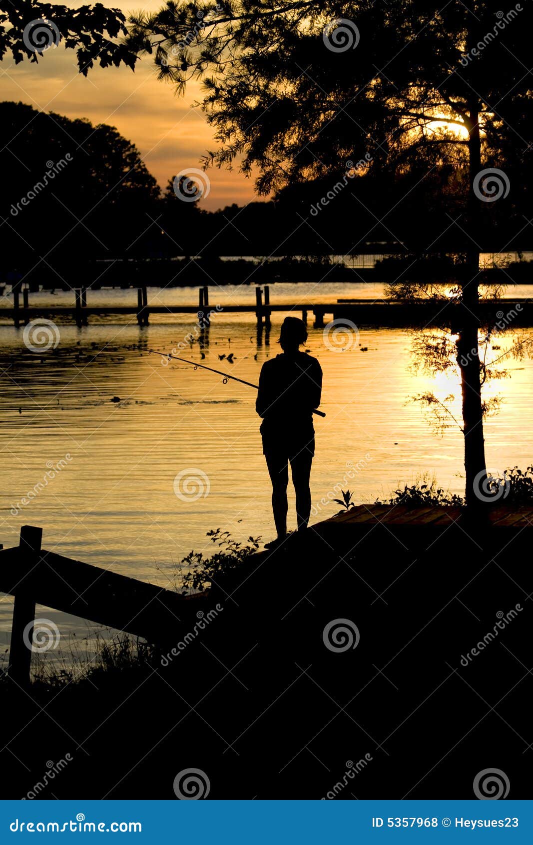 Fishing sunset silhouette stock photo. Image of person - 5357968