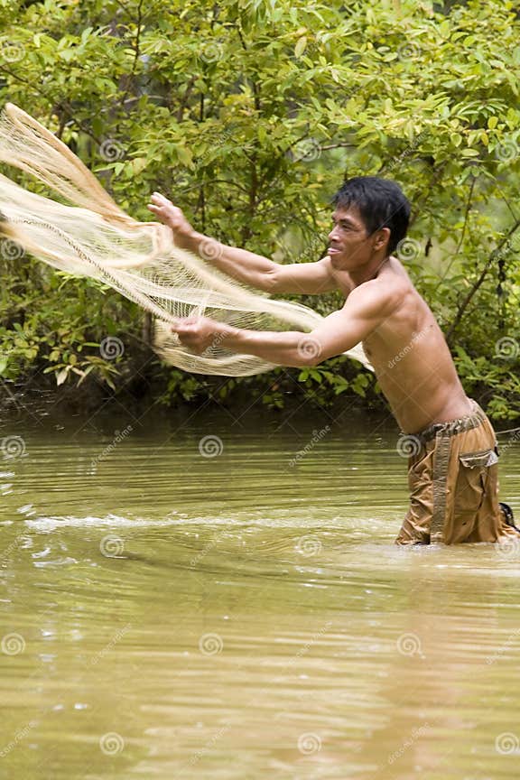 Fishing with a throw net stock image. Image of fishing - 4636563