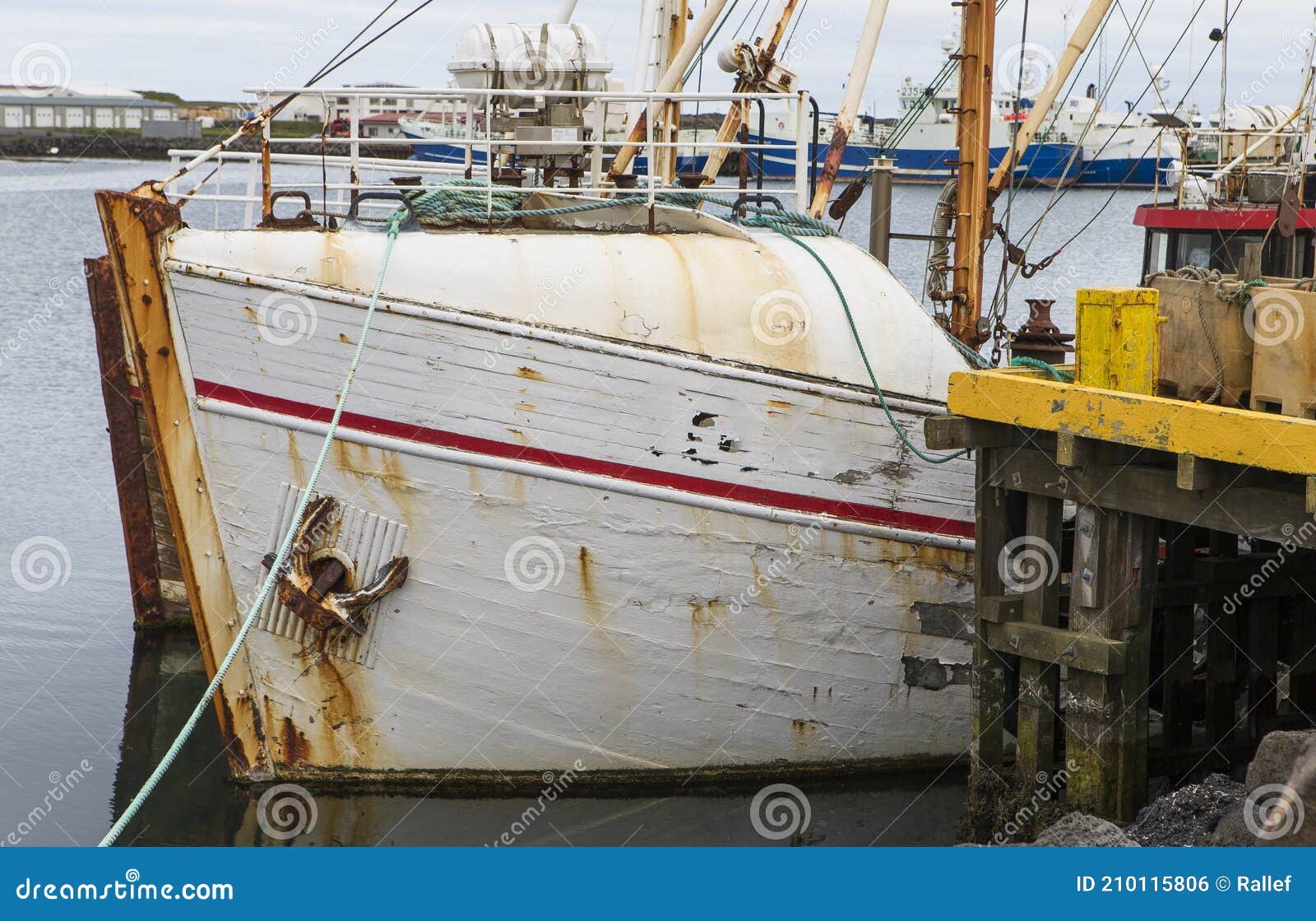 Fishing trawler on pier stock photo. Image of masts - 210115806