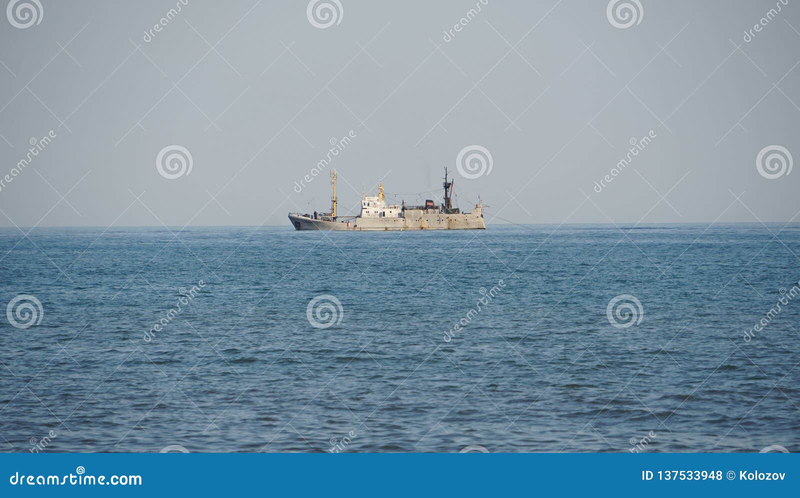 Fishing Vessel in the Sea on the Horizon Stock Photo - Image of ...
