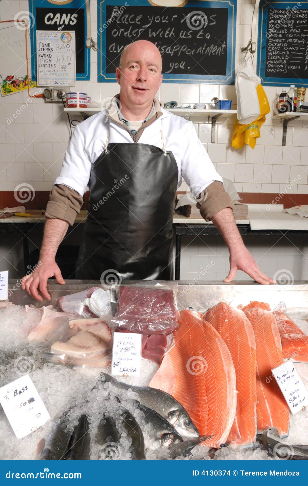 Fishmonger in apron stock photo. Image of food, fresh - 4130374