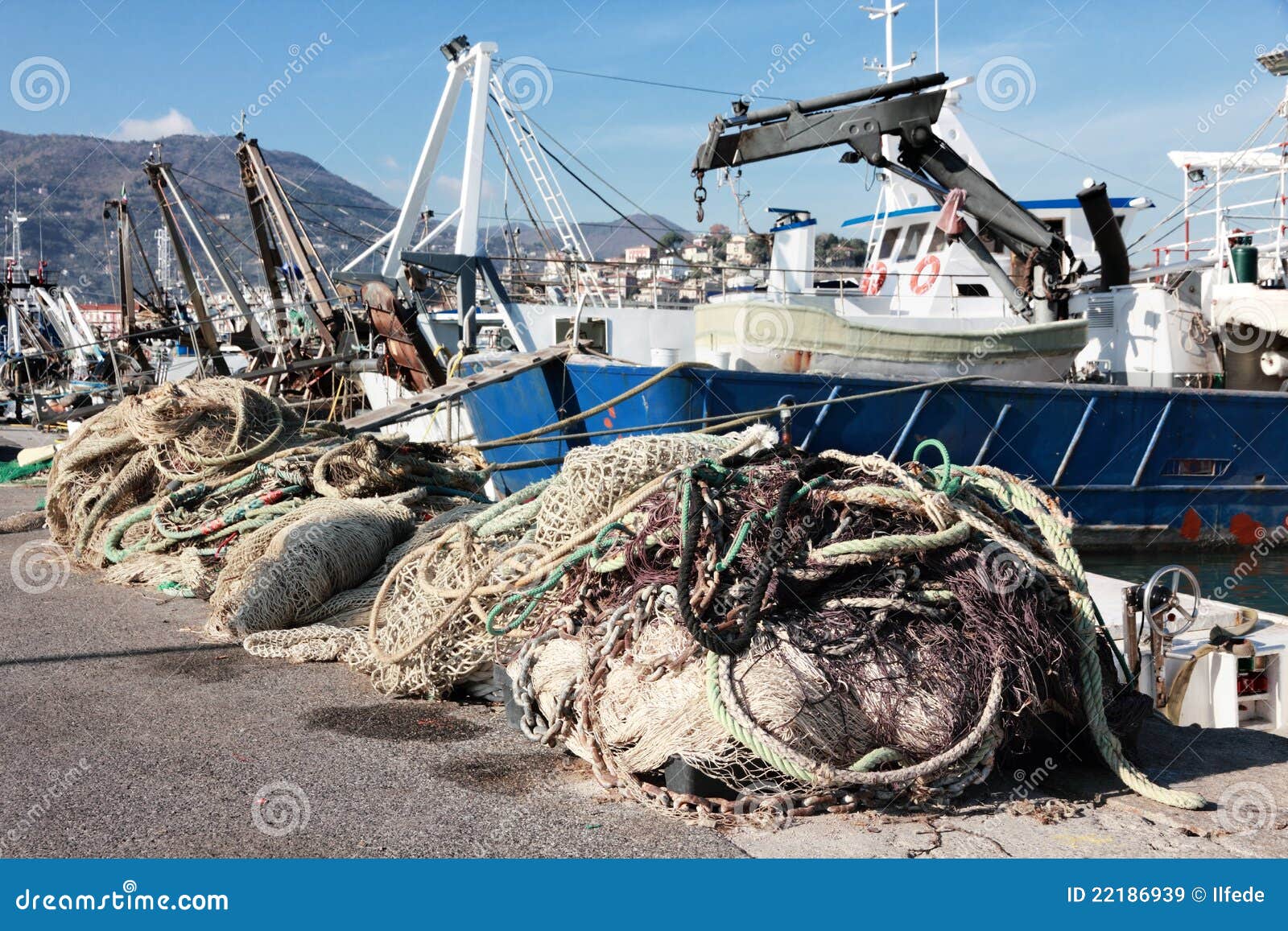 Fishnet and fishing boat stock image. Image of harbour - 22186939