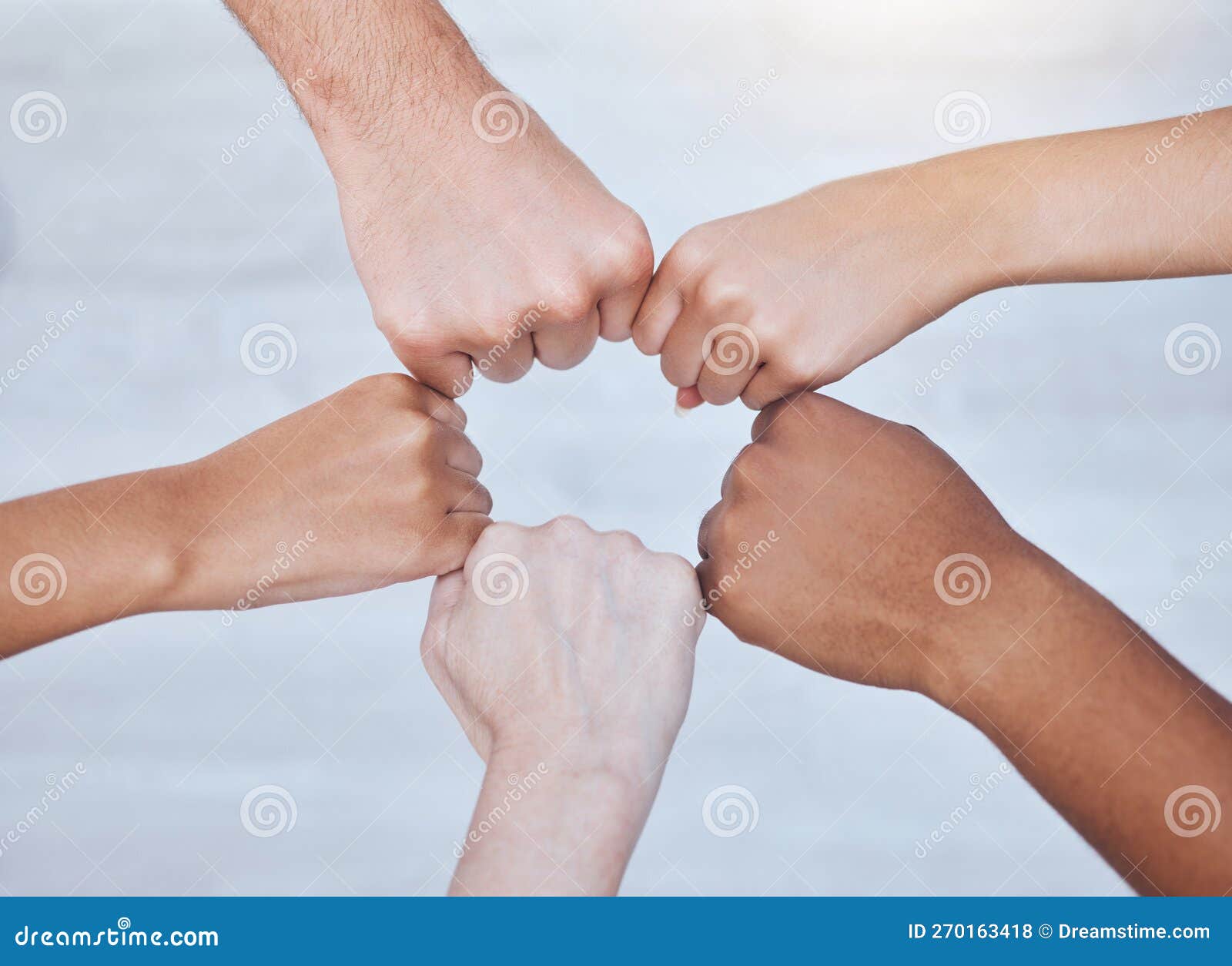 Fist Bump, Unity and Support Group Touching Hands in a Circle at a ...