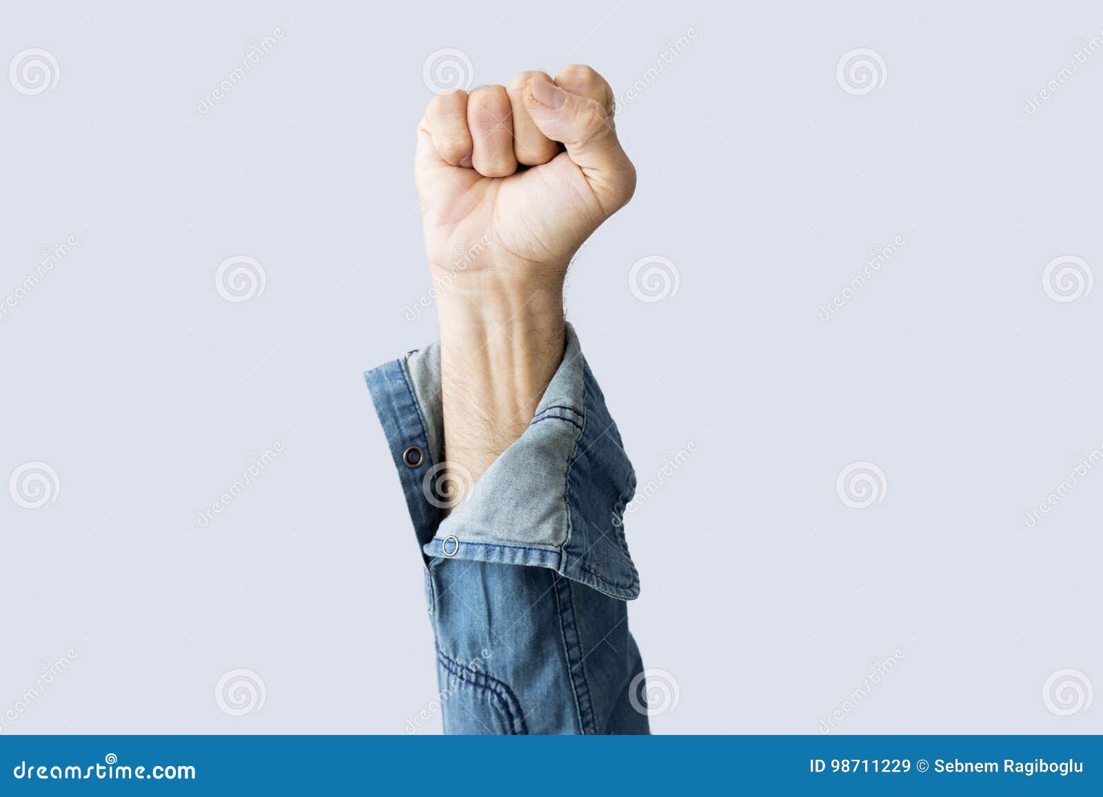 Fist Raised on Grey Background Stock Image - Image of gesture, force ...