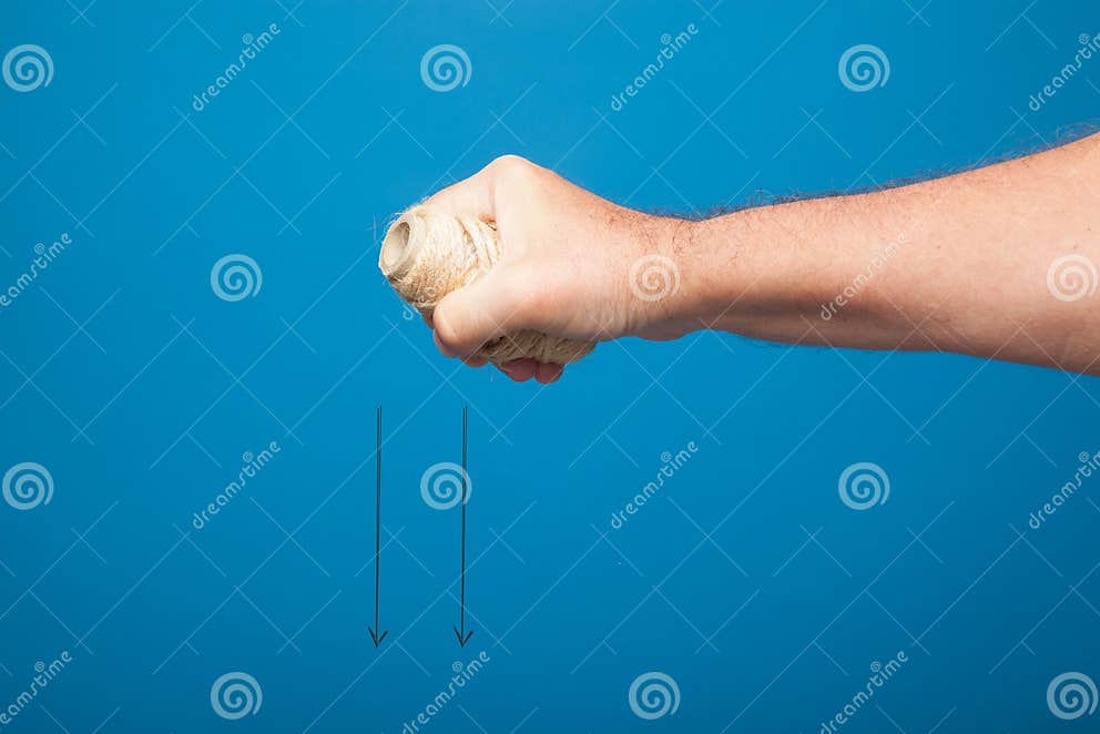 Fist of the Right Hand with Rope Stock Photo - Image of roll, bottom ...