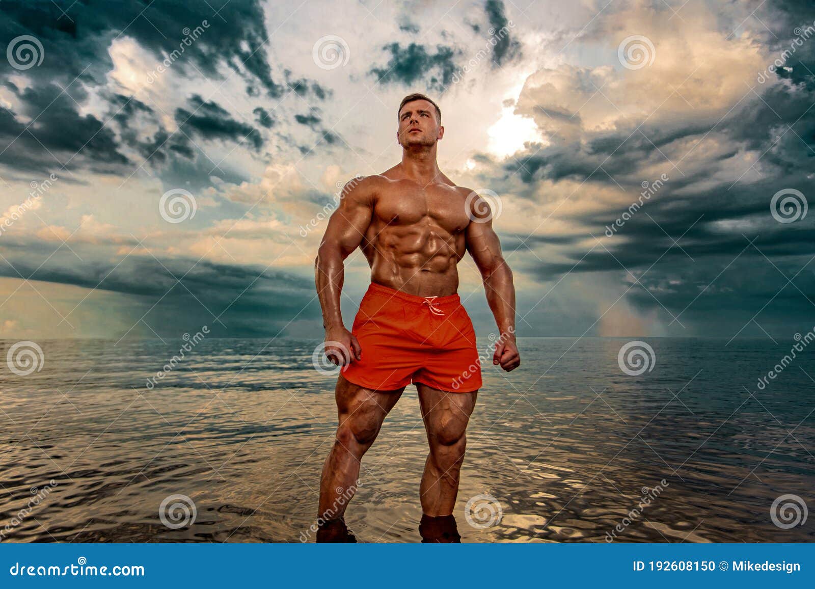 Fit Athlete Bodybuilder On The Beach Attractive Young Man Lifeguard On