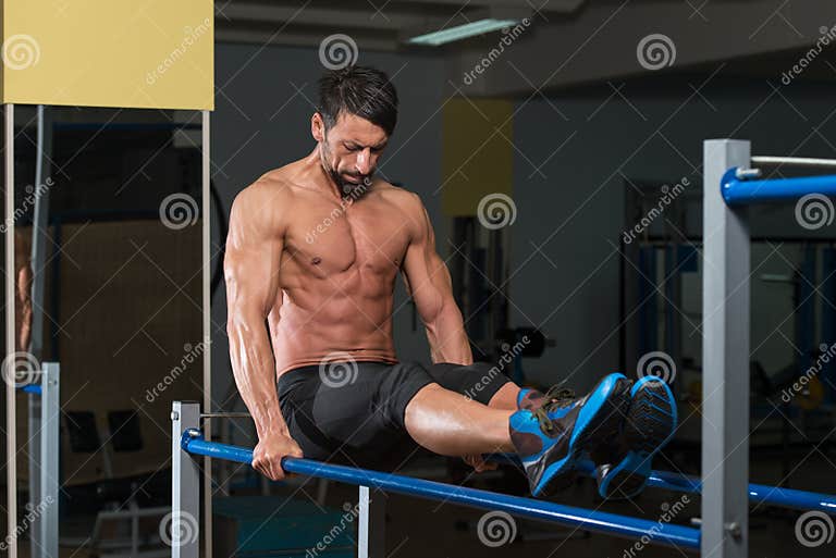 Fit Athlete Doing Exercise on Parallel Bars Stock Photo - Image of ...