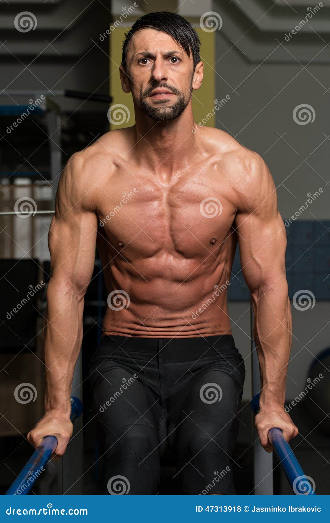 Fit Athlete Doing Exercise on Parallel Bars Stock Photo - Image of ...