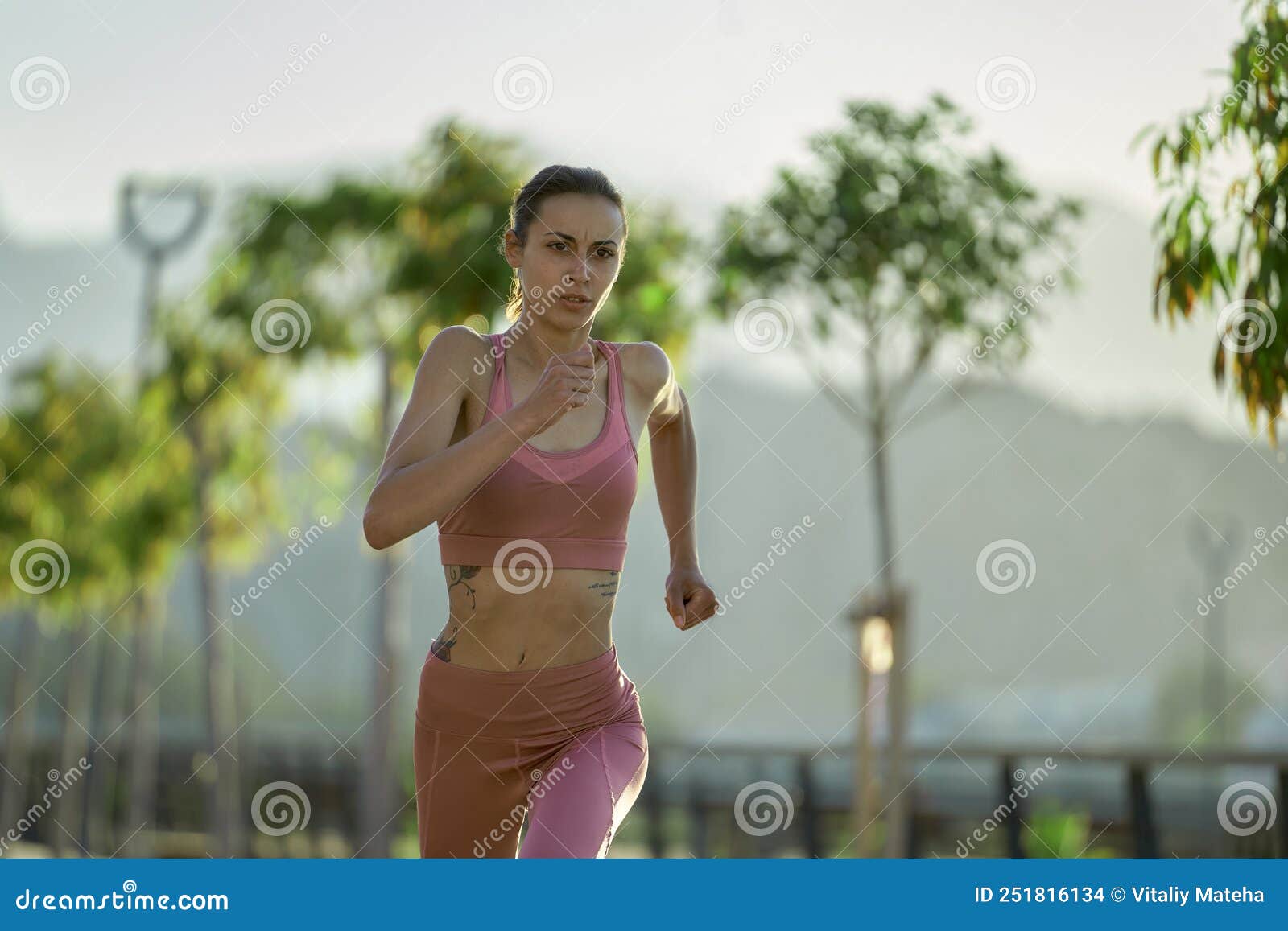 Fit Athletic Woman Runner in Fast Motion Training Outdoors Stock Photo ...