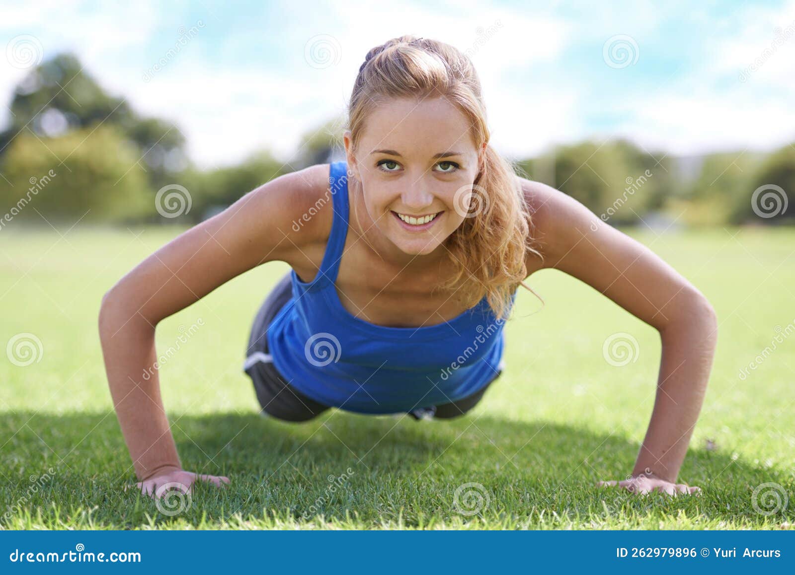 Fit and Confident. an Attractive Young Woman Doing Pushups Outside ...