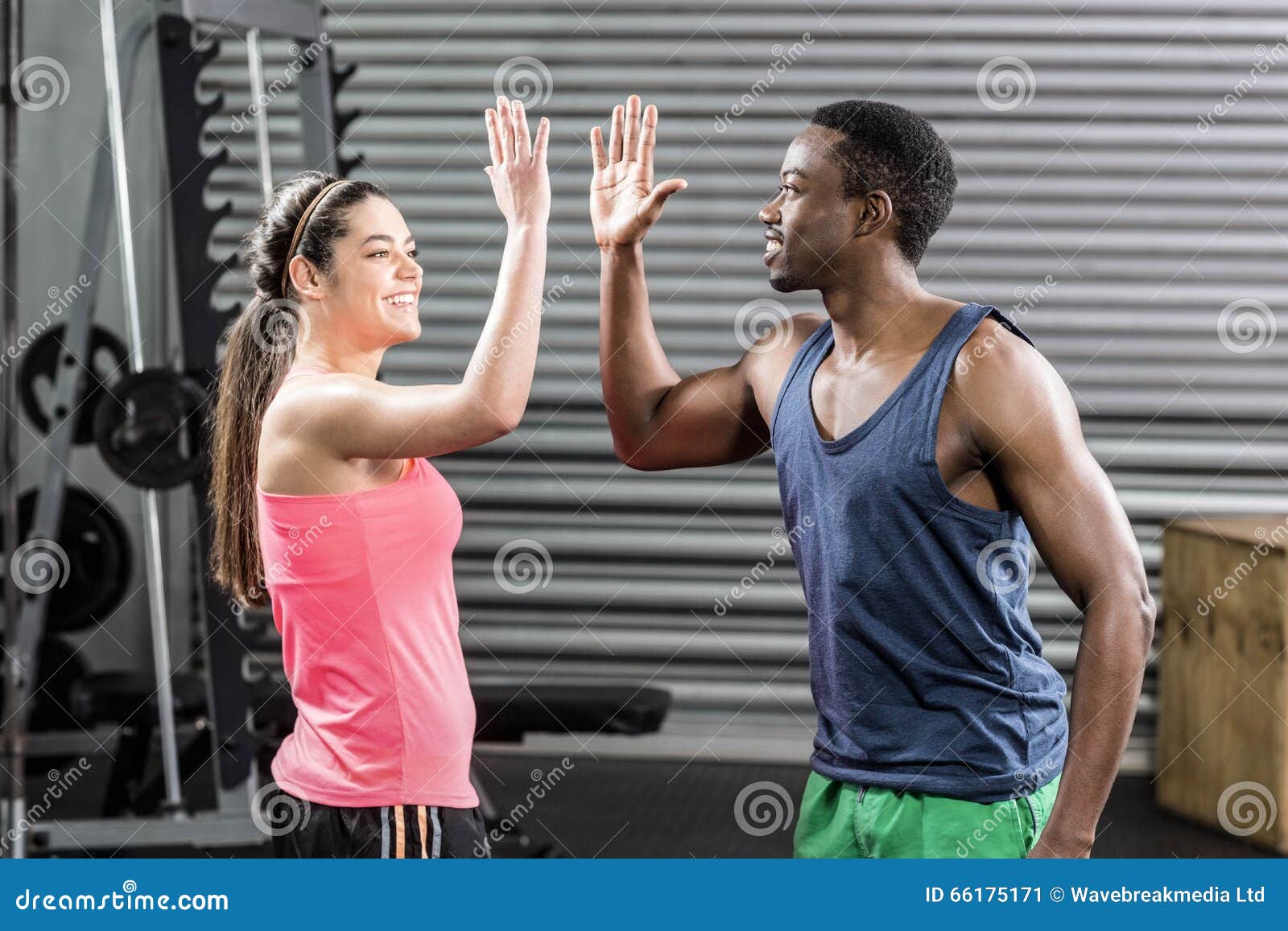 Fit couple doing high five stock image. Image of cheerful - 66175171