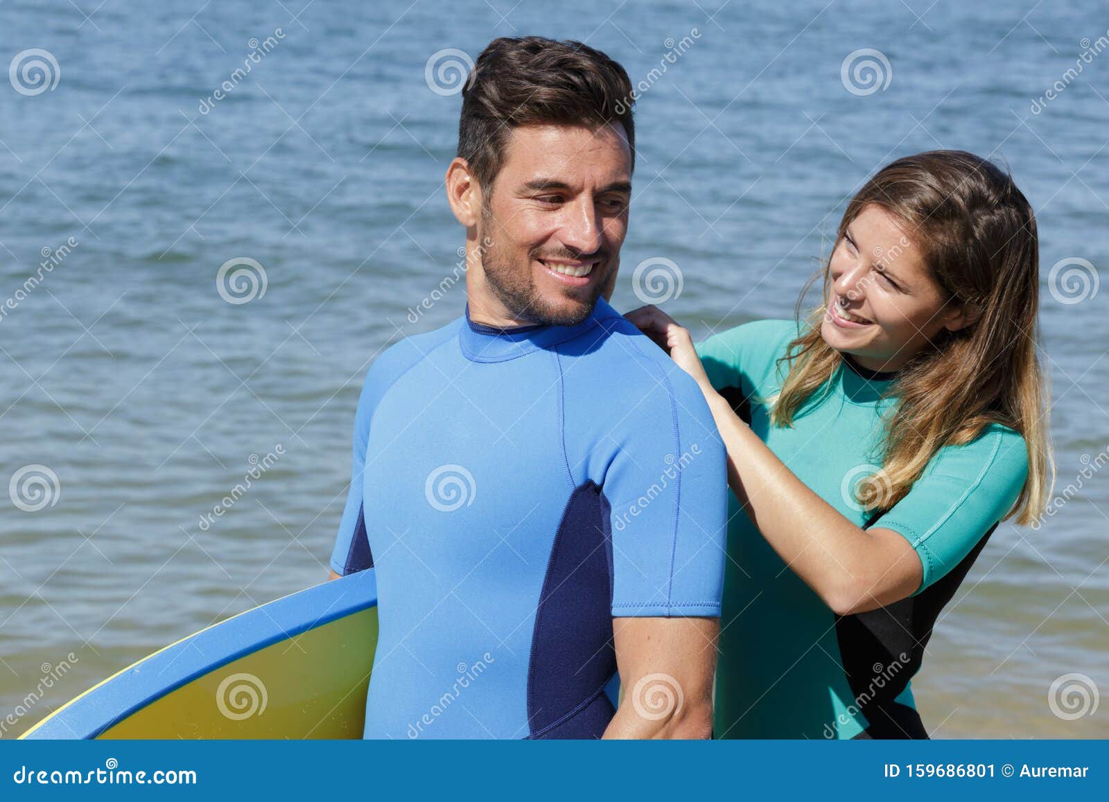 Fit couple surfers stock image. Image of surfing, moment - 159686801