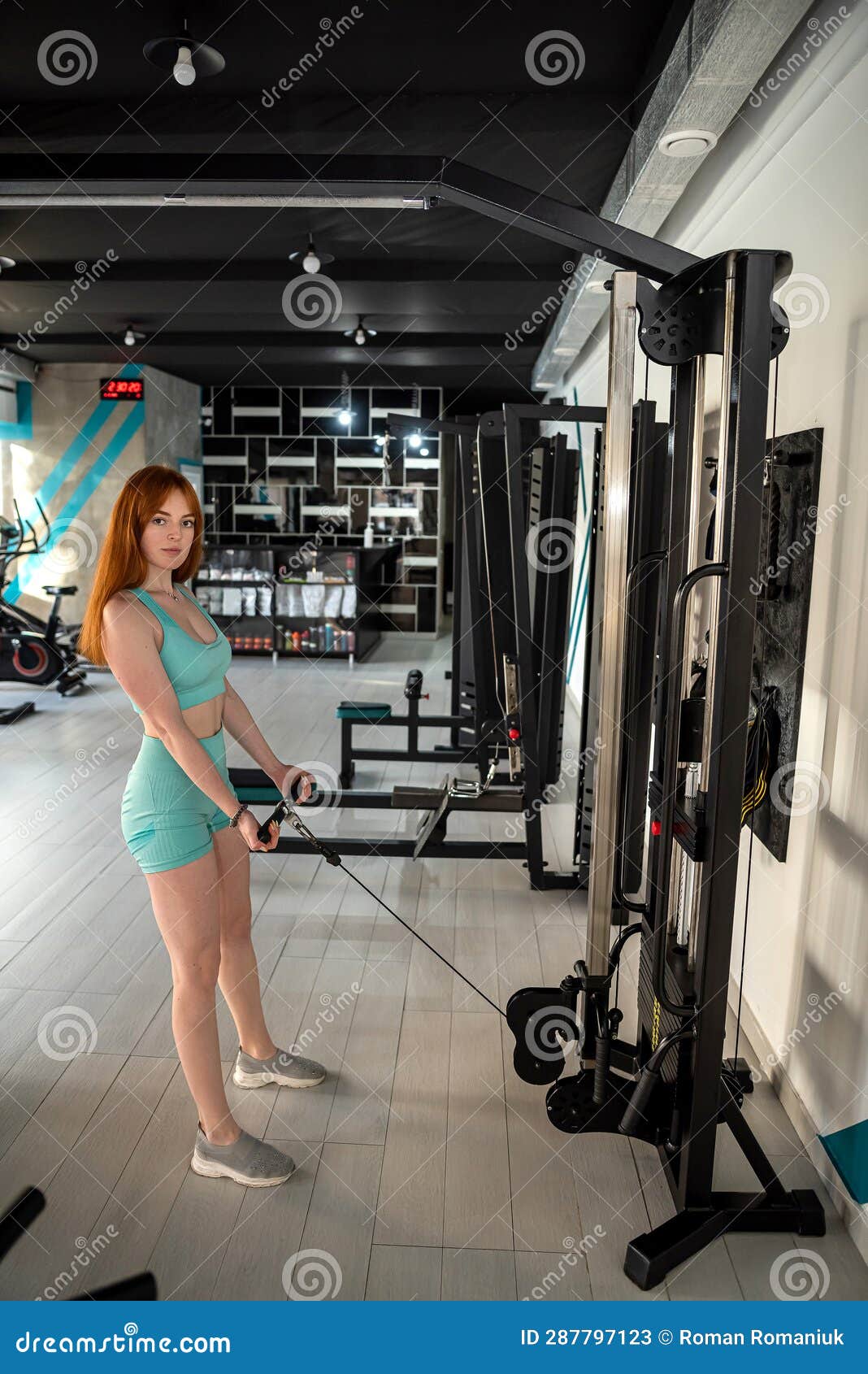 Fit Female Trainer or Client at Gym Doing Exercises with Lat Pulldown ...