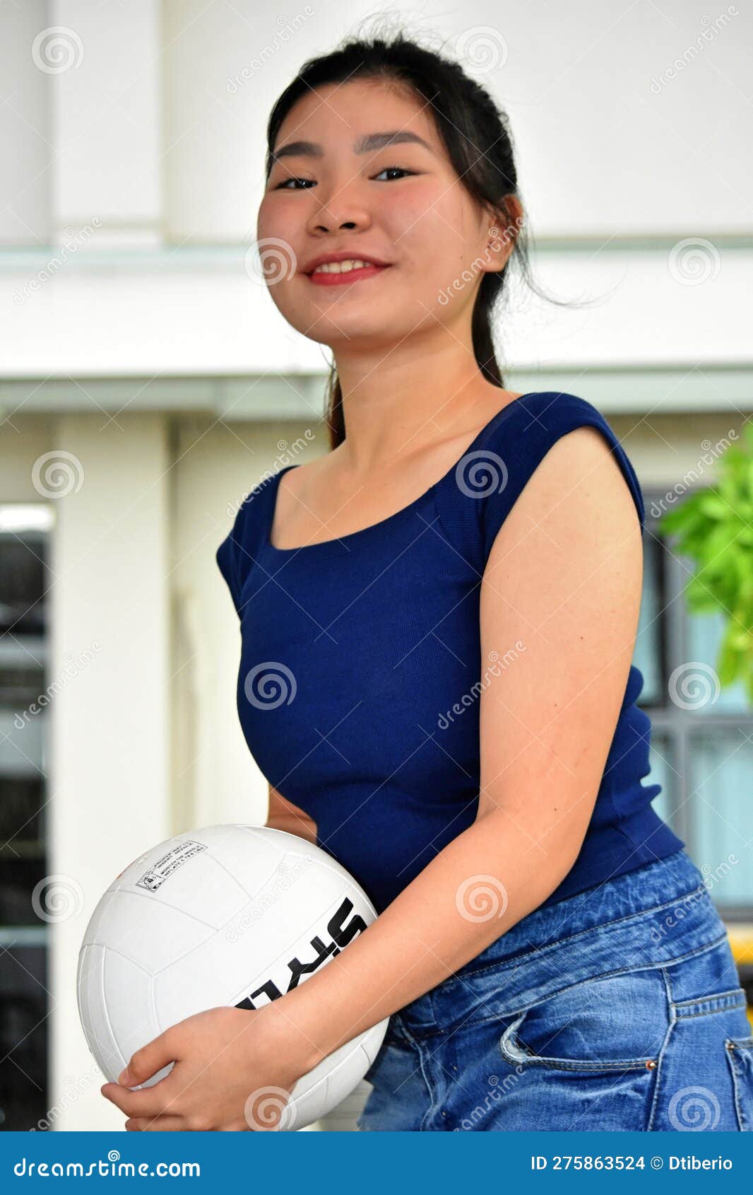 Fit Filipina Female Volleyball Player Smiling with Volleyball Stock ... Fit Filipina Female Volleyball Player Smiling with Volleyball Stock ...