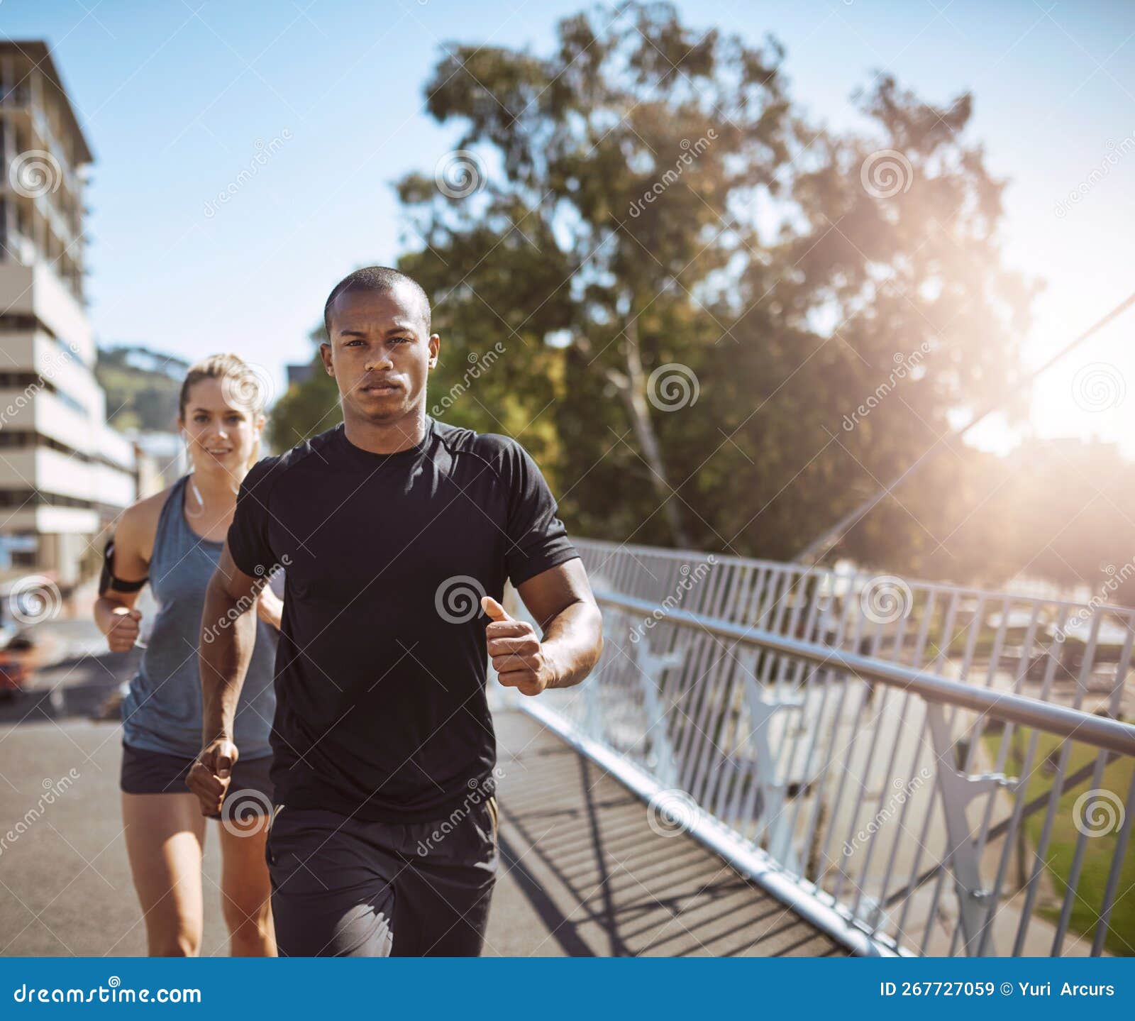 Fit and Focused. Two Young People Talking a Run in the City. Stock ...