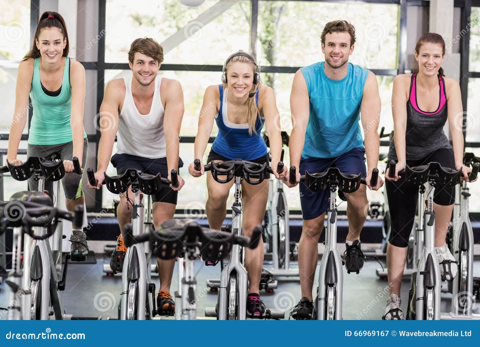 Fit Group of People Using Exercise Bike Together Stock Image - Image of ...