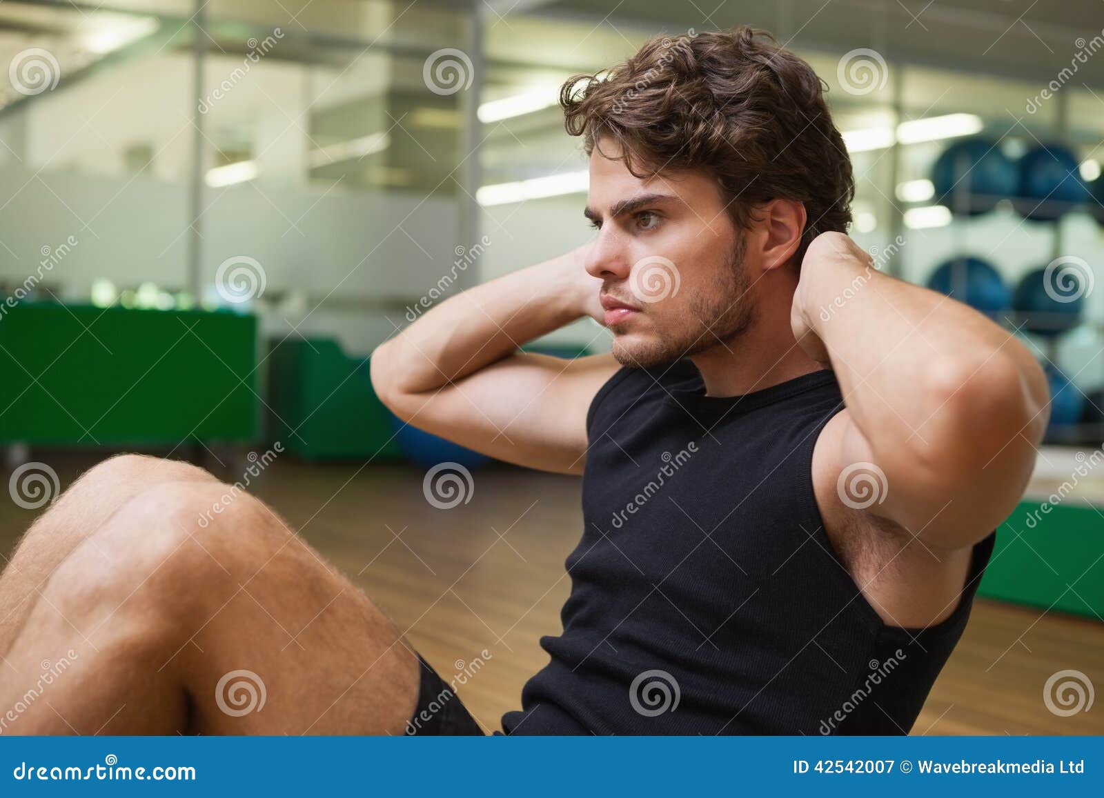 Fit Handsome Man Doing Sit Ups in Fitness Studio Stock Image - Image of ...