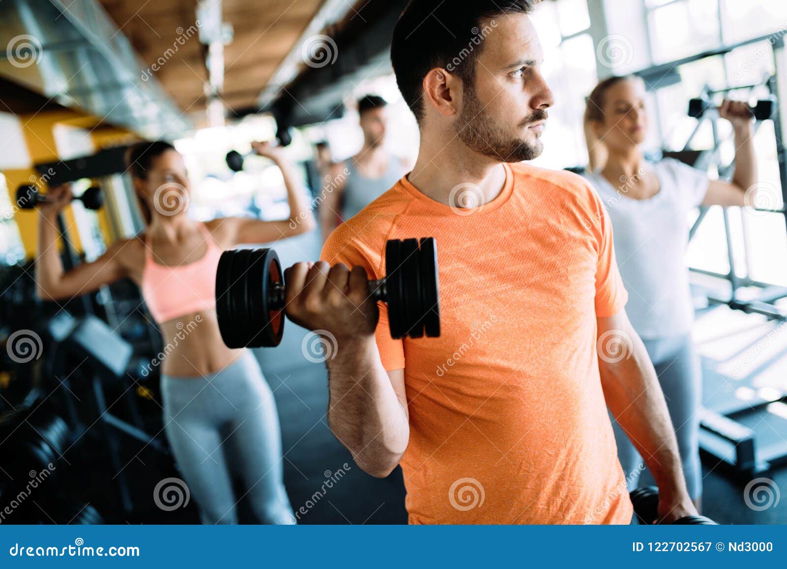 Fit Man Exercising at the Gym on a Machine Stock Image - Image of body ...