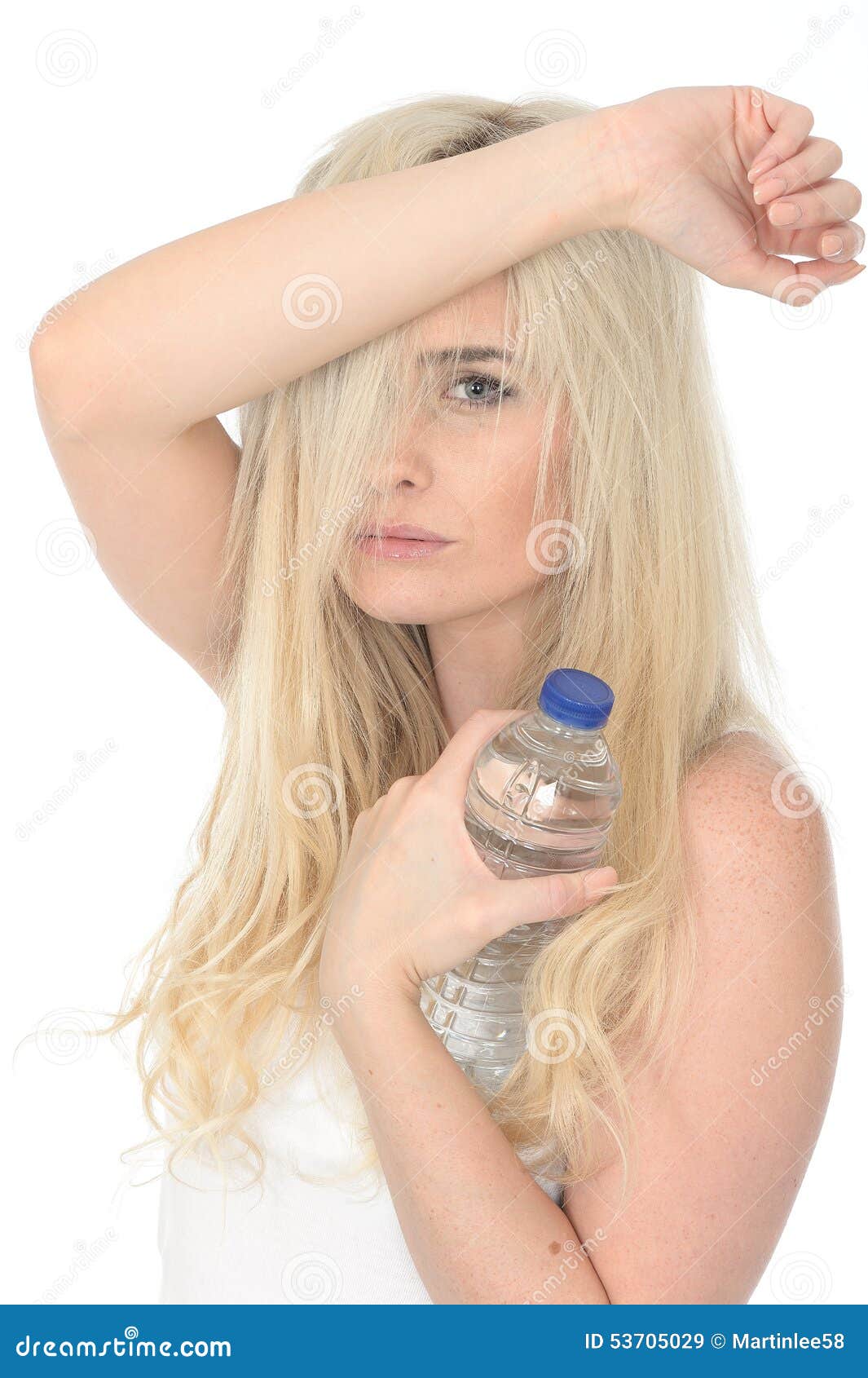 Fit Healthy Young Natural Blonde Woman Holding A Bottle Of Mineral