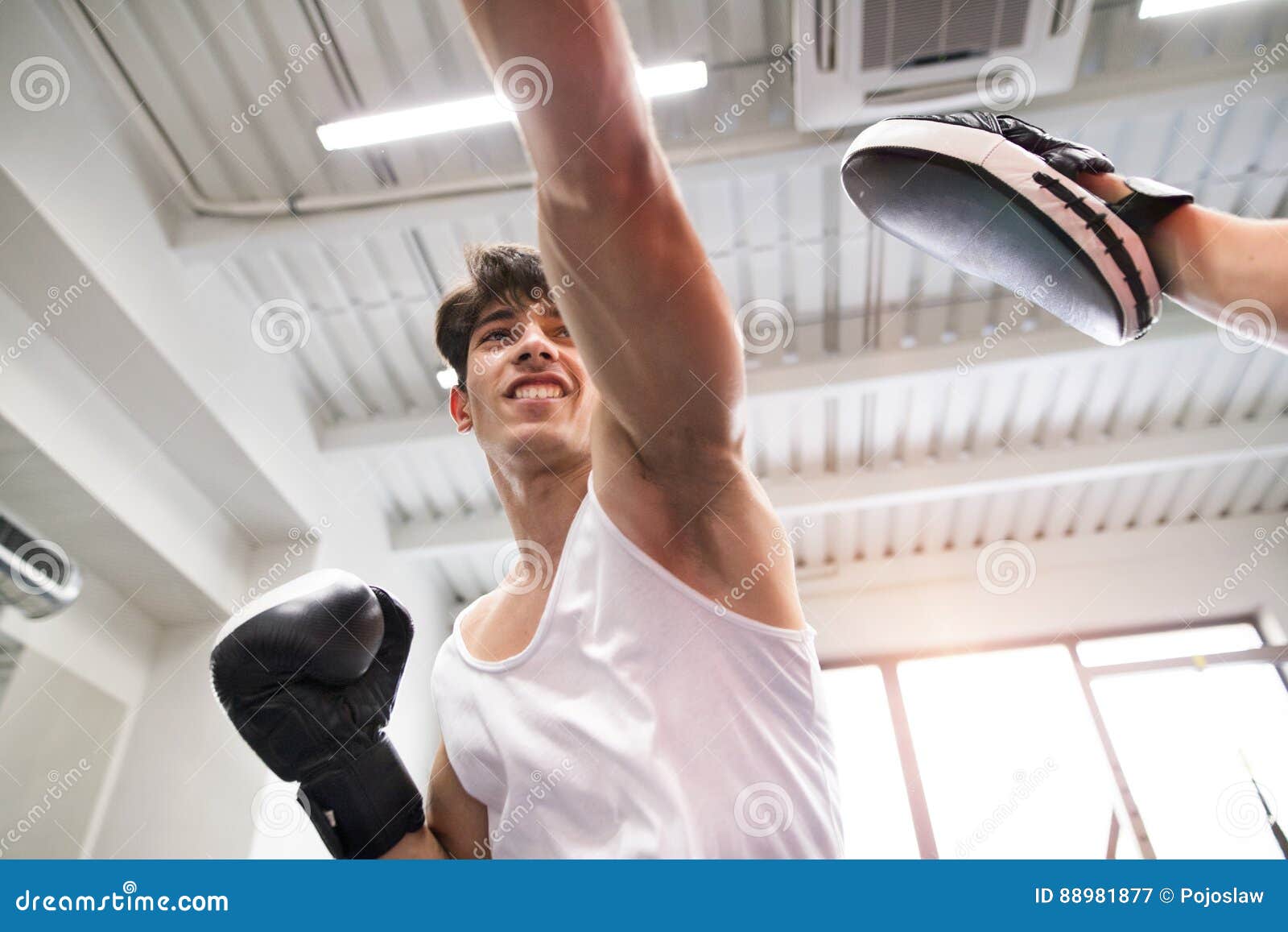 Fit Hispanic Man in Gym Boxing with Unrecognizable Rival Stock Image ...