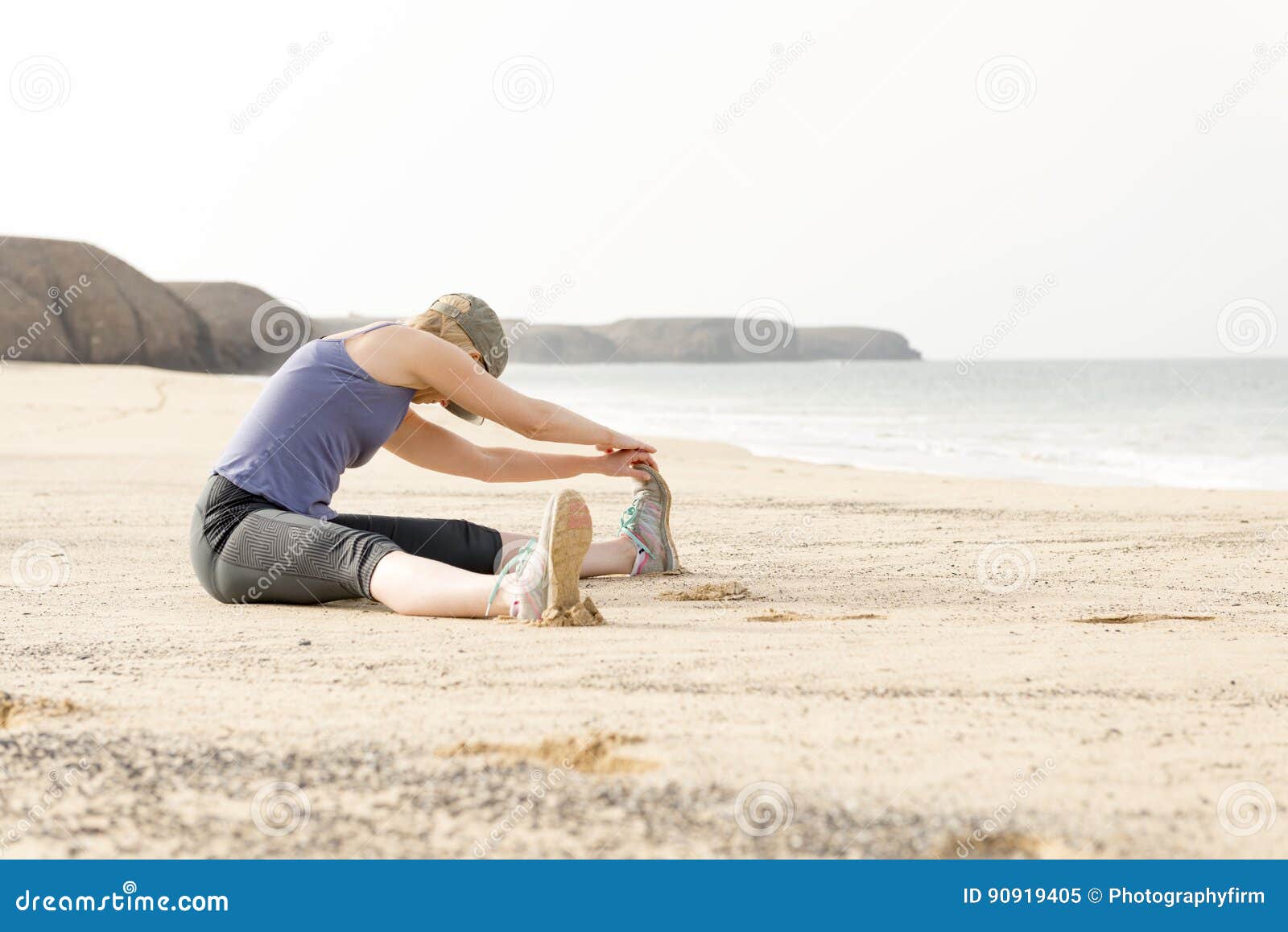 Fit Lady Sitting on a Beach Doing Leg Stretches Stock Image - Image of ...