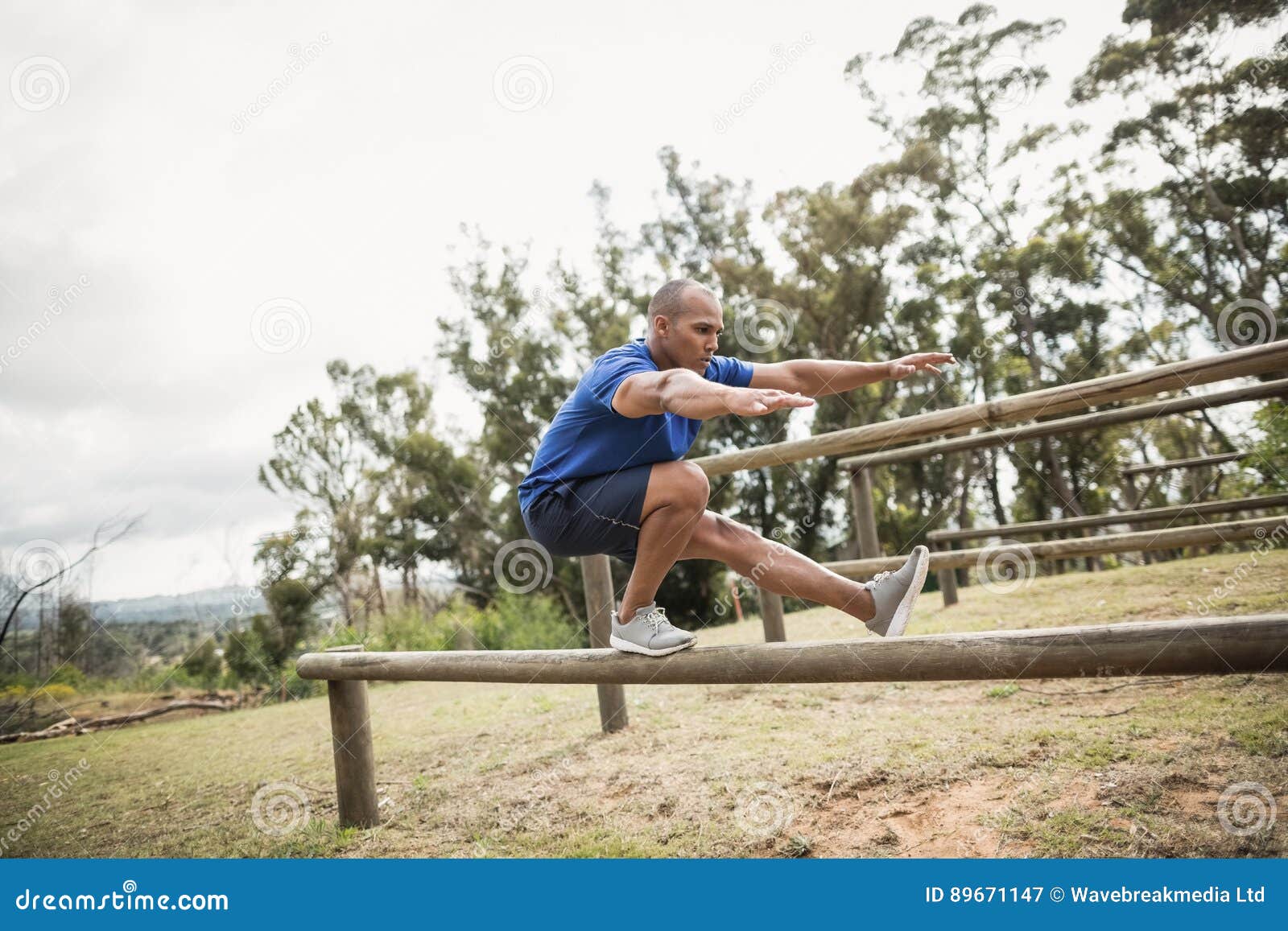 Fit Man Balancing on Hurdles during Obstacle Course Training Stock ...