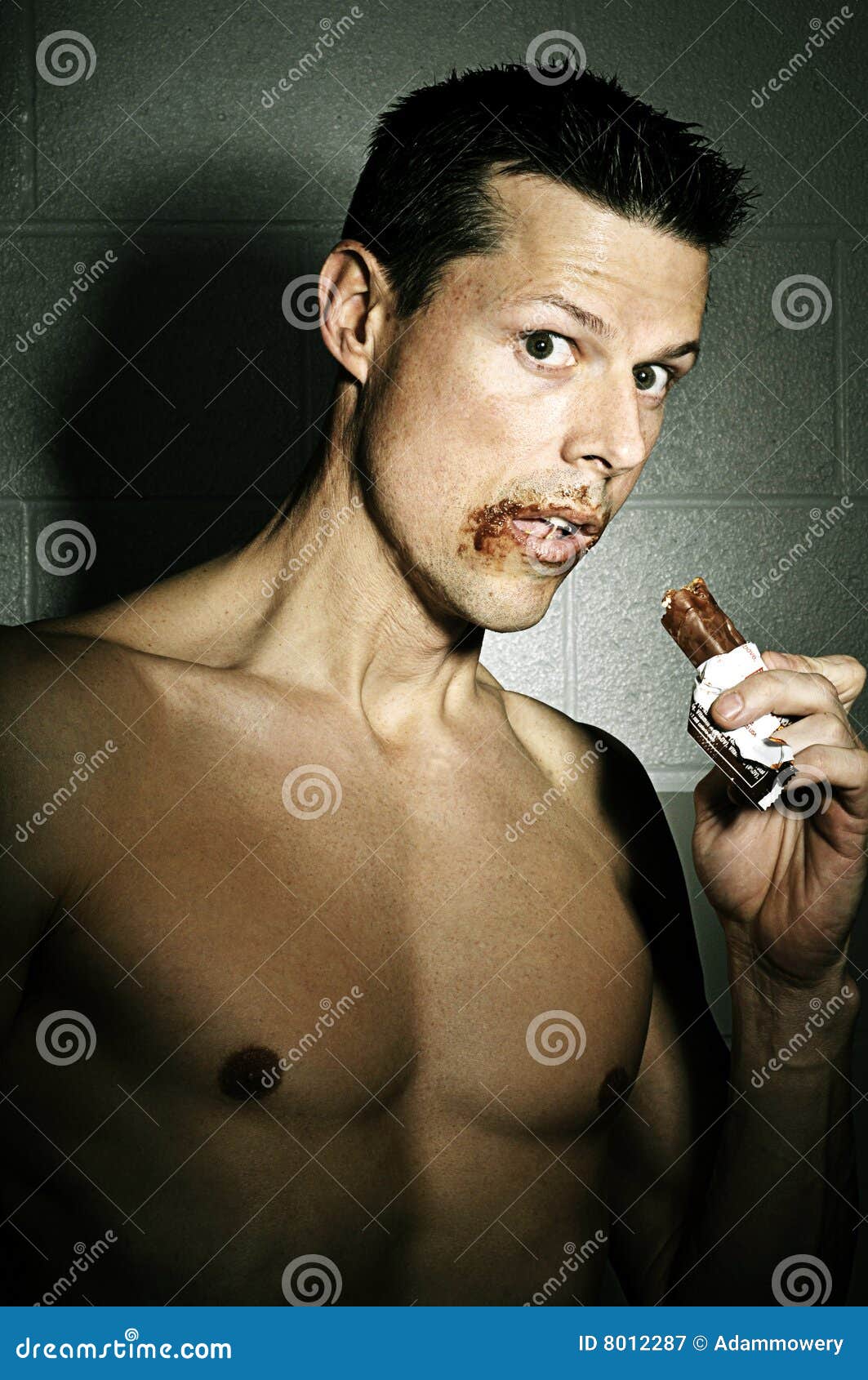 Fit Man Caught Eating Candy Stock Image - Image of handsome, shock: 8012287