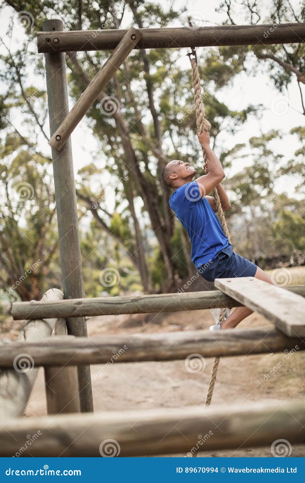 Fit Man Climbing a Rope during Obstacle Course Stock Photo - Image of ...