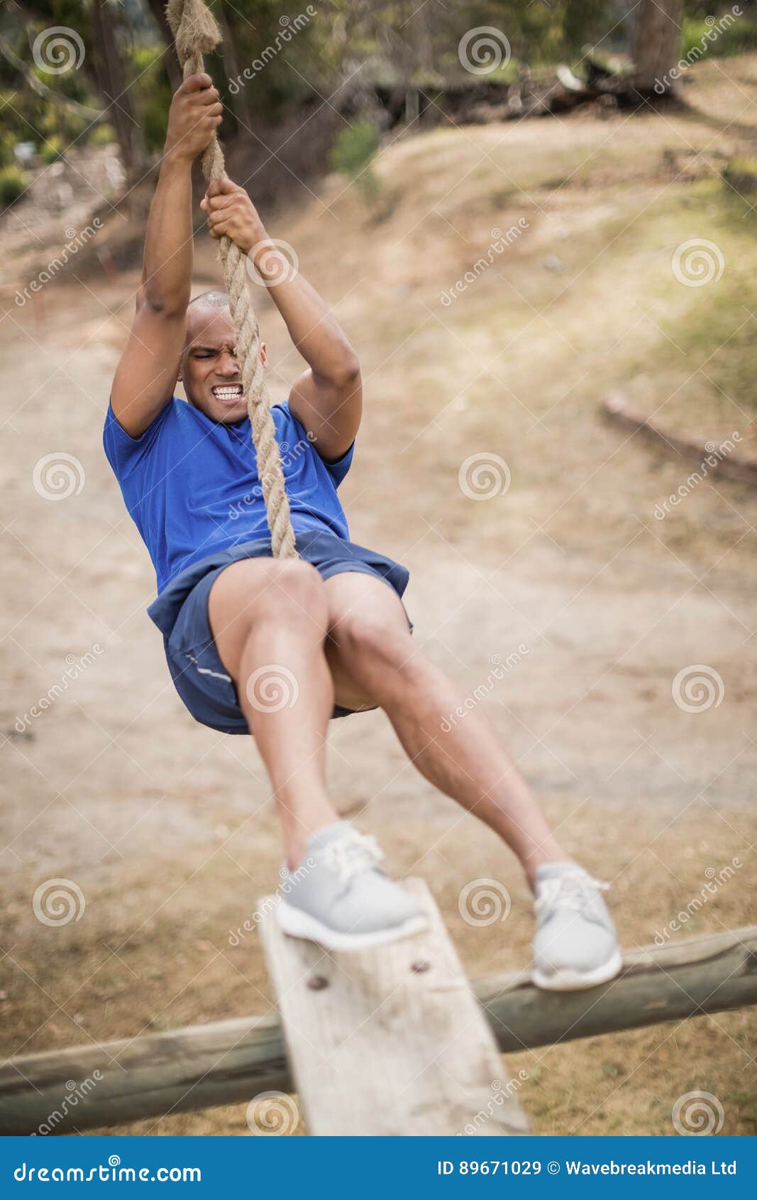 Fit Man Climbing a Rope during Obstacle Course Stock Image - Image of ...