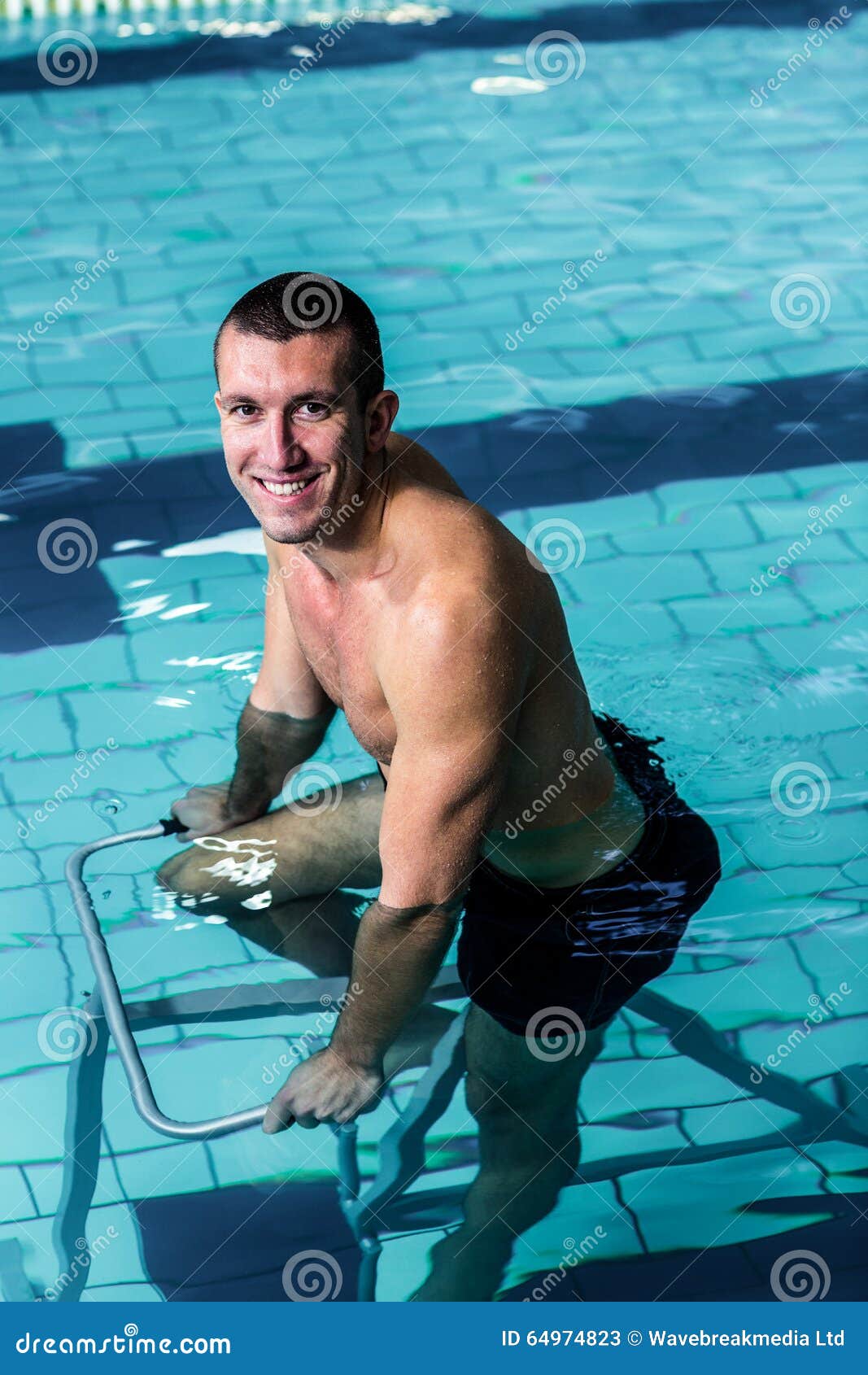 Fit Man Cycling in the Pool Stock Image - Image of adult, sporty: 64974823