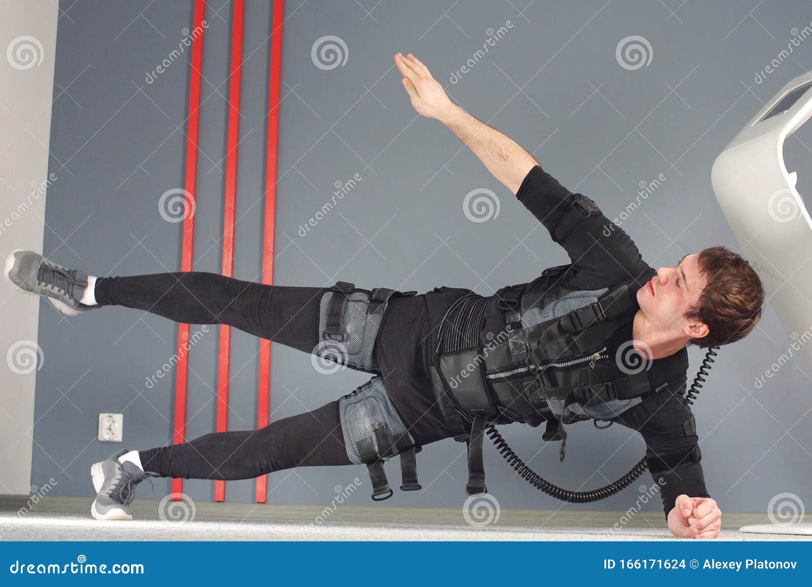Fit Man in Electrical Muscular Stimulation Suits Doing Side Plank ...