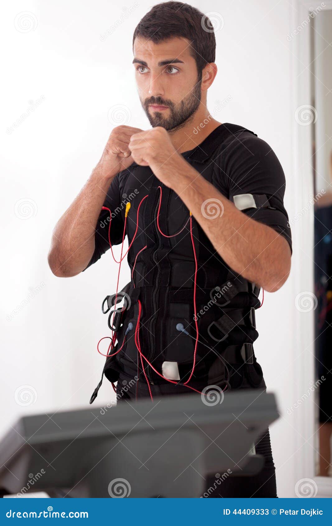 Fit Man Exercise on Electro Muscular Stimulation Machine Stock Image ...