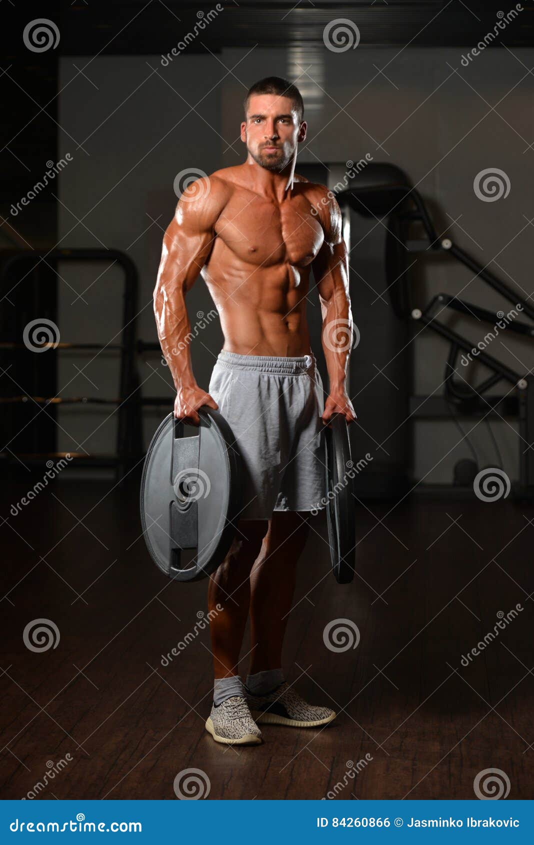 Fit Man Holding Weights in Hand Stock Photo - Image of human, confident ...