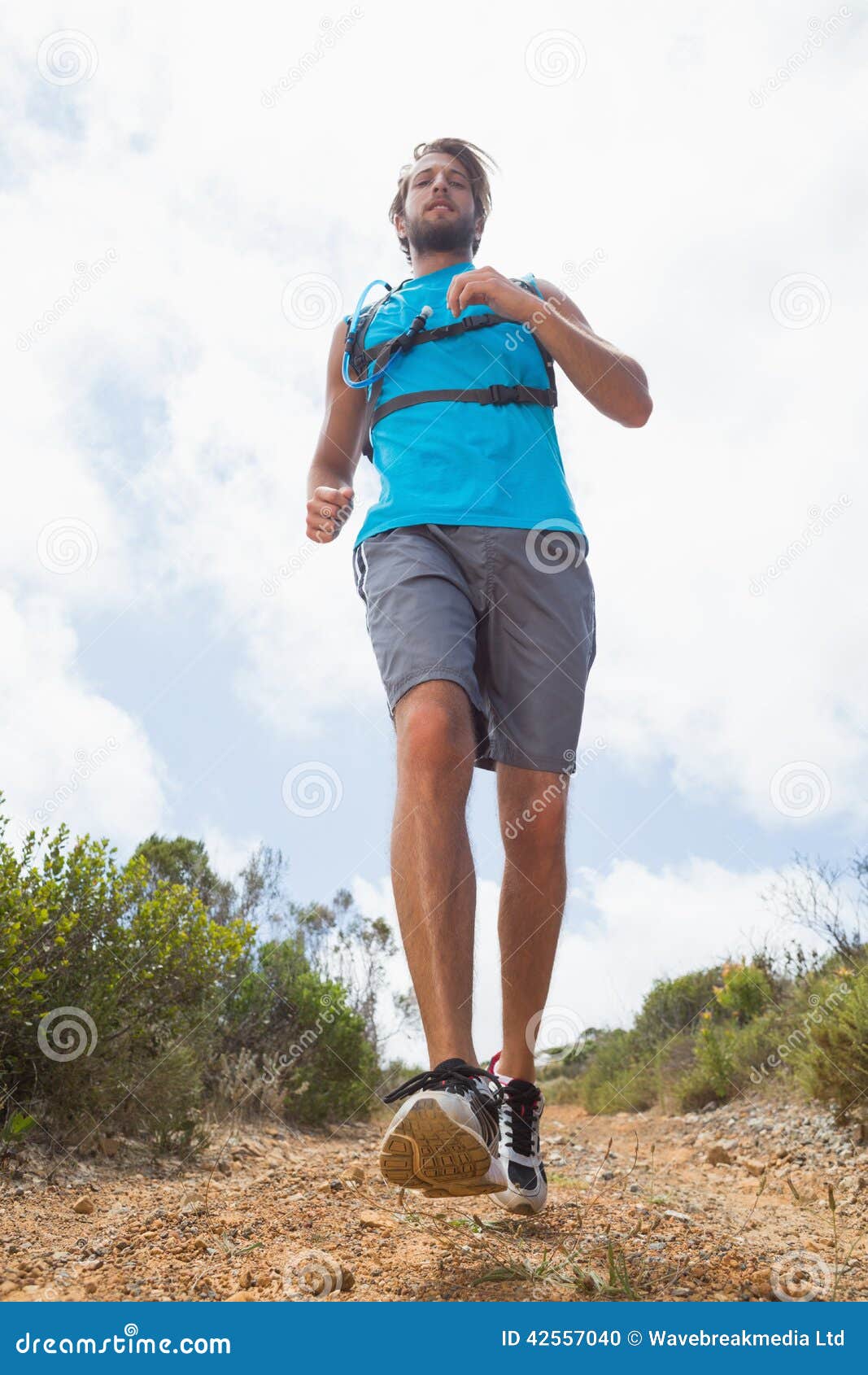 Fit Man Jogging Down Mountain Trail Stock Photo - Image of athletic ...