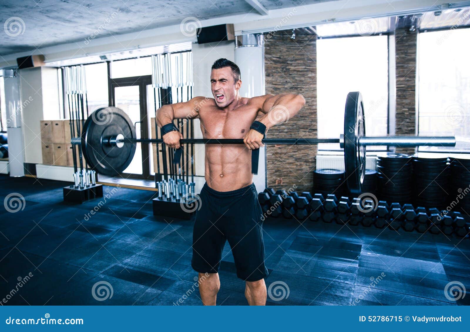 Fit man lifting barbell stock image. Image of male, aerobics - 52786715