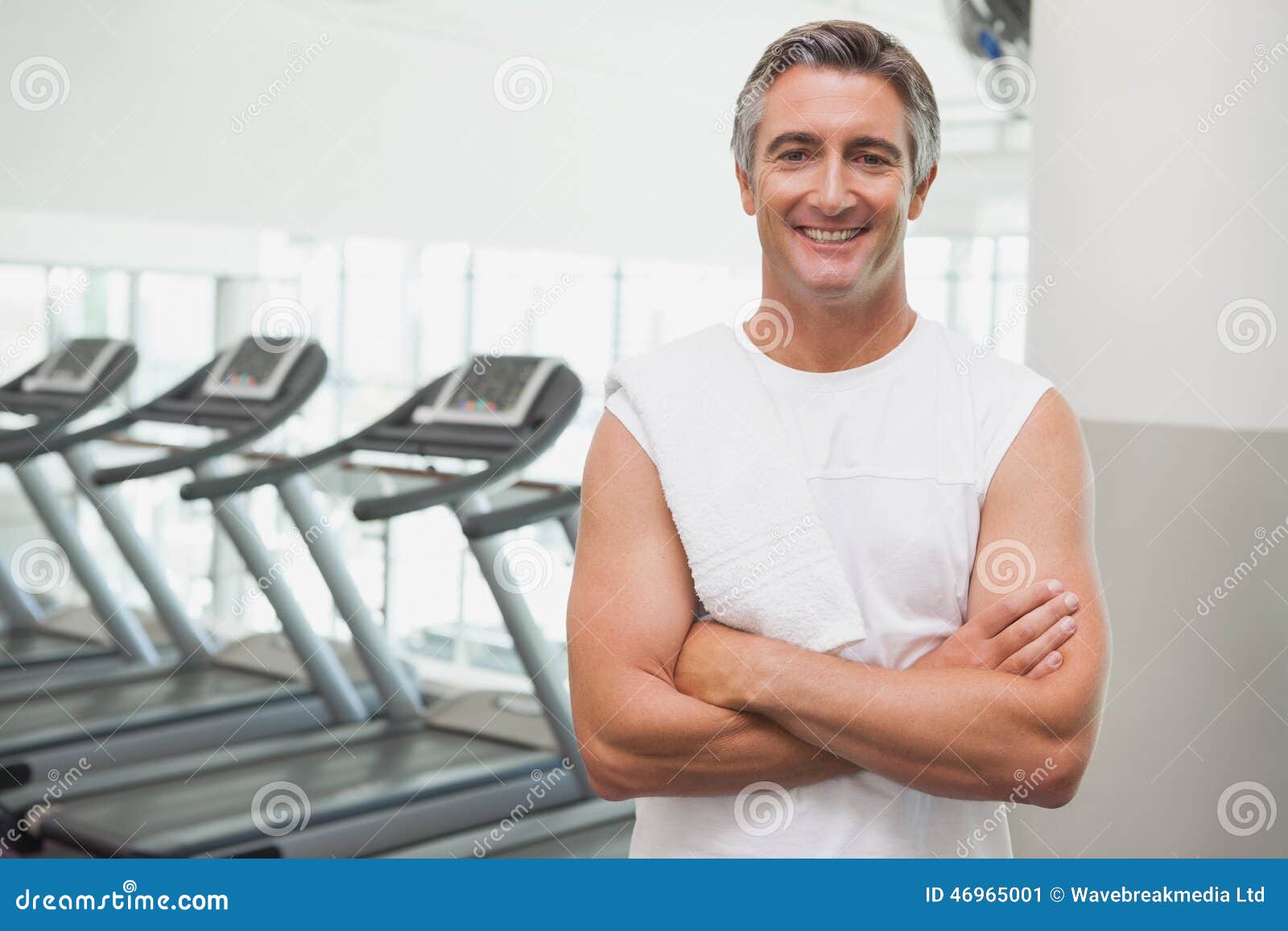 Fit Man Smiling at Camera beside Treadmills Stock Image - Image of ...