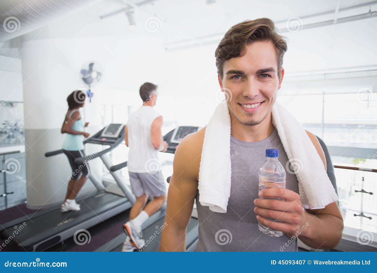 Fit Man Smiling at Camera beside Treadmills Stock Image - Image of ...