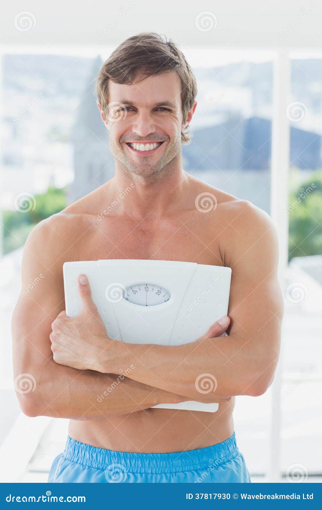 Fit Man Standing with Scale in Exercise Room Stock Photo - Image of ...