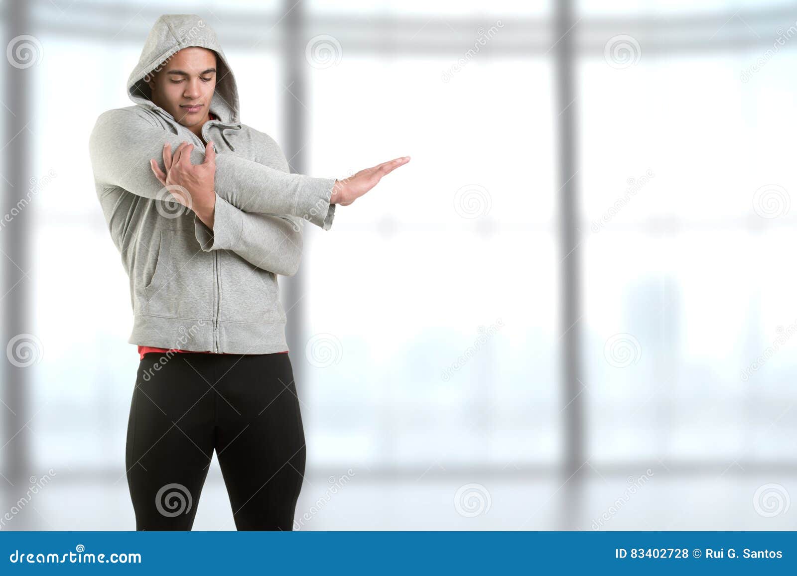 Fit Man Stretching His Arm stock photo. Image of handsome - 83402728