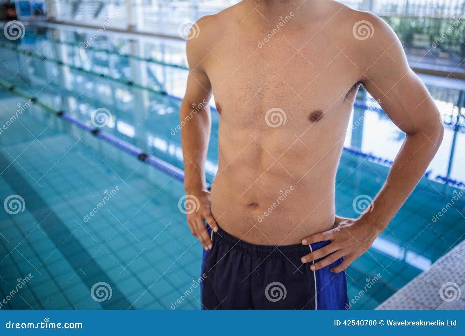 Fit Man in Swimming Trunks Standing by the Pool Stock Photo - Image of ...