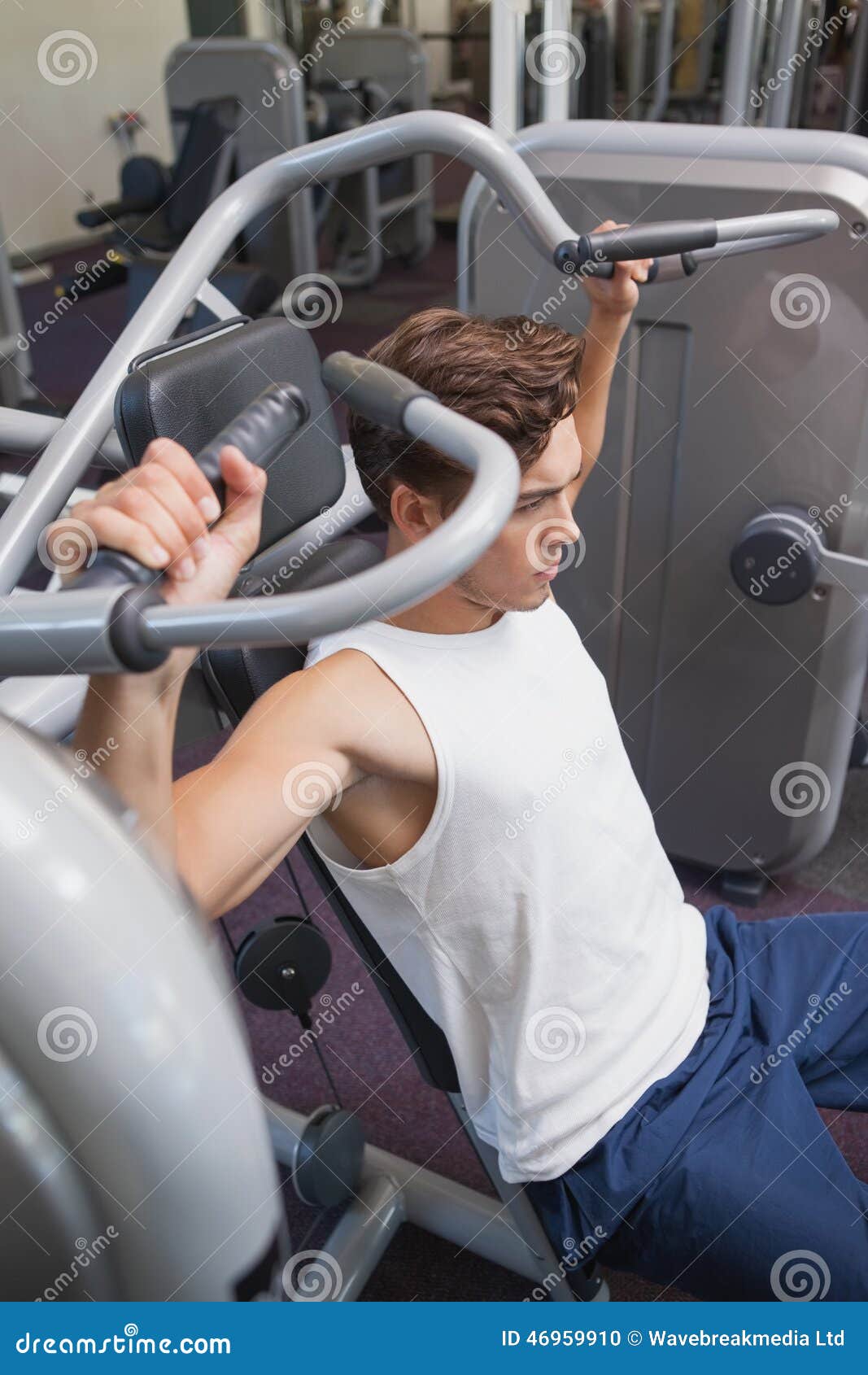 Fit Man Using Weights Machine for Arms Stock Photo - Image of high ...