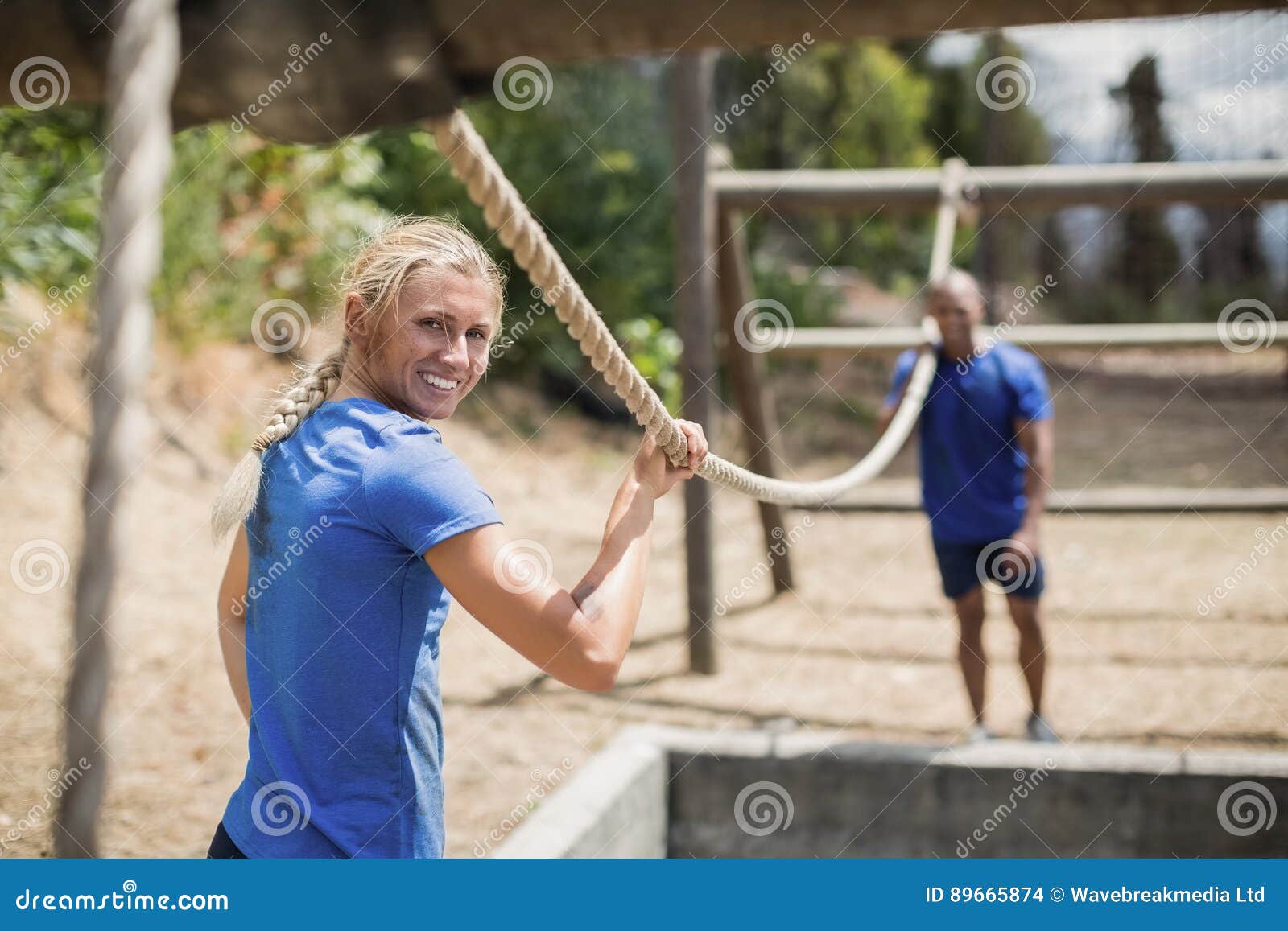 Fit Man and Woman Practicing during Obstacle Course Stock Photo - Image ...