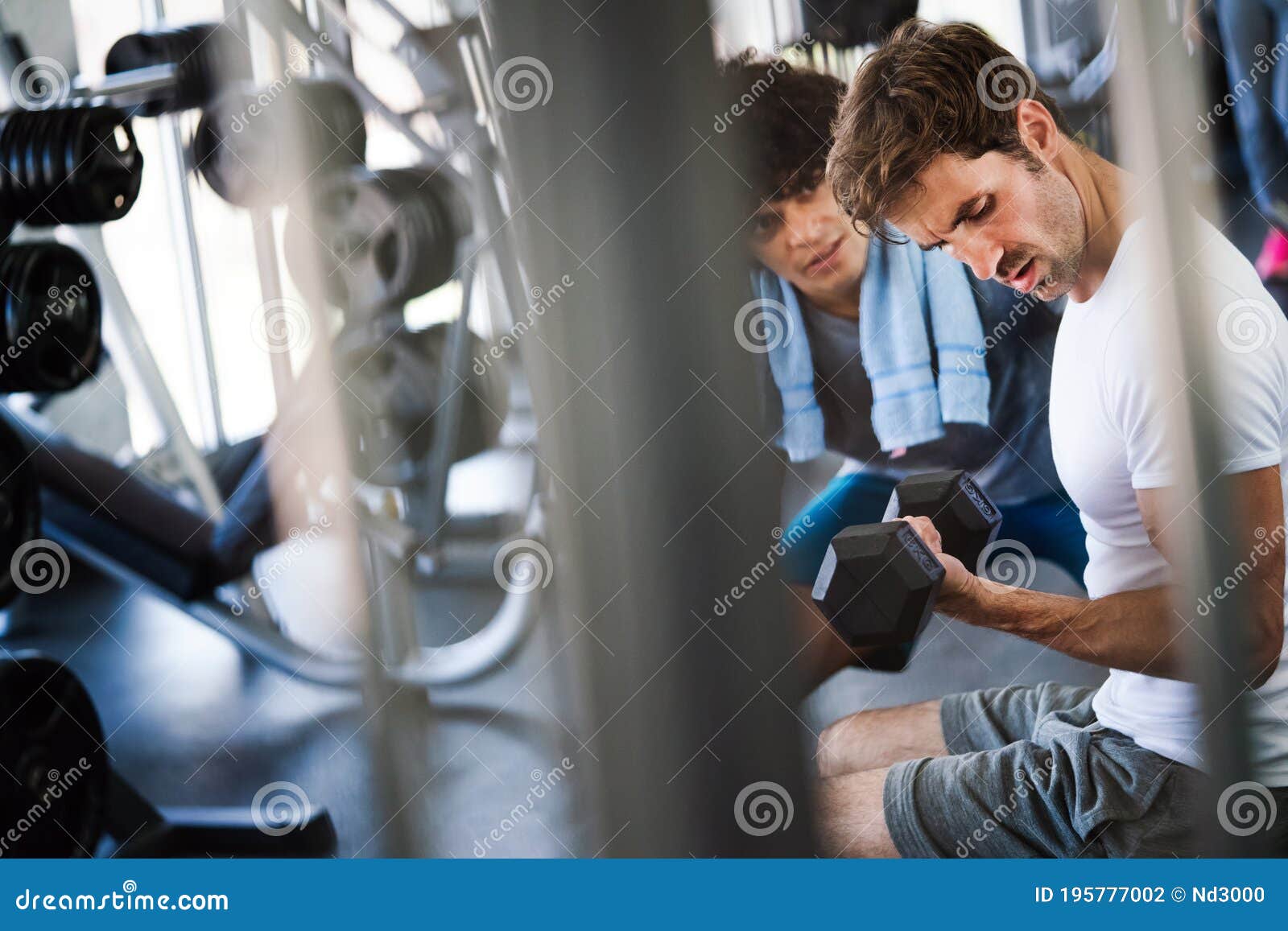 Fit Man Working Out in Gym with Personal Trainer Stock Photo - Image of ...