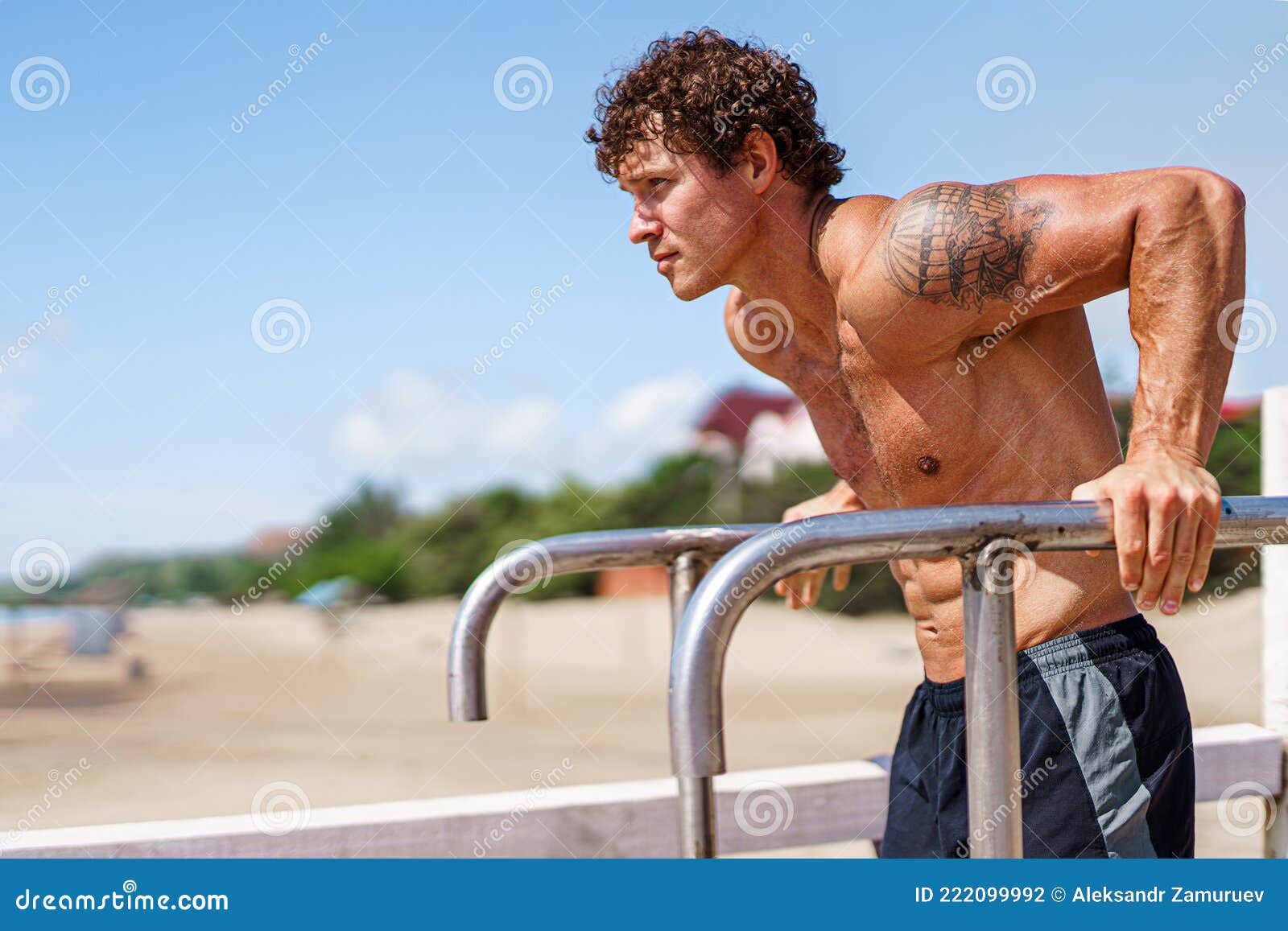 Fit Man Workout Out Arms on Dips Horizontal Bars Training Triceps and ...