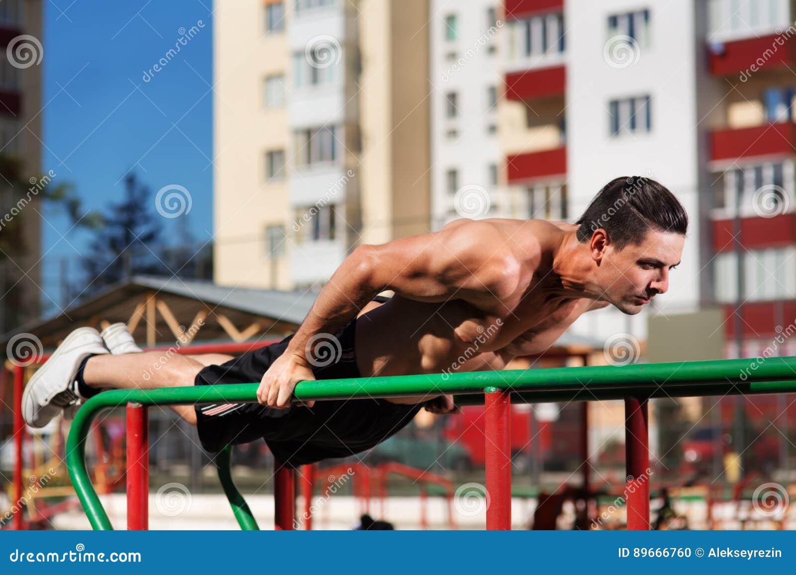 Fit Man Workout Out Arms on Dips Horizontal Bars Training Triceps and ...