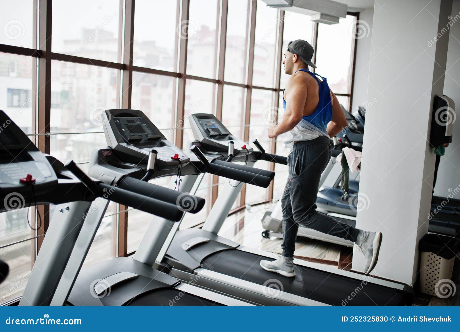 Fit and Muscular Arabian Man Running on Treadmill in Gym Stock Photo ... Fit and Muscular Arabian Man Running on Treadmill in Gym Stock Photo ...
